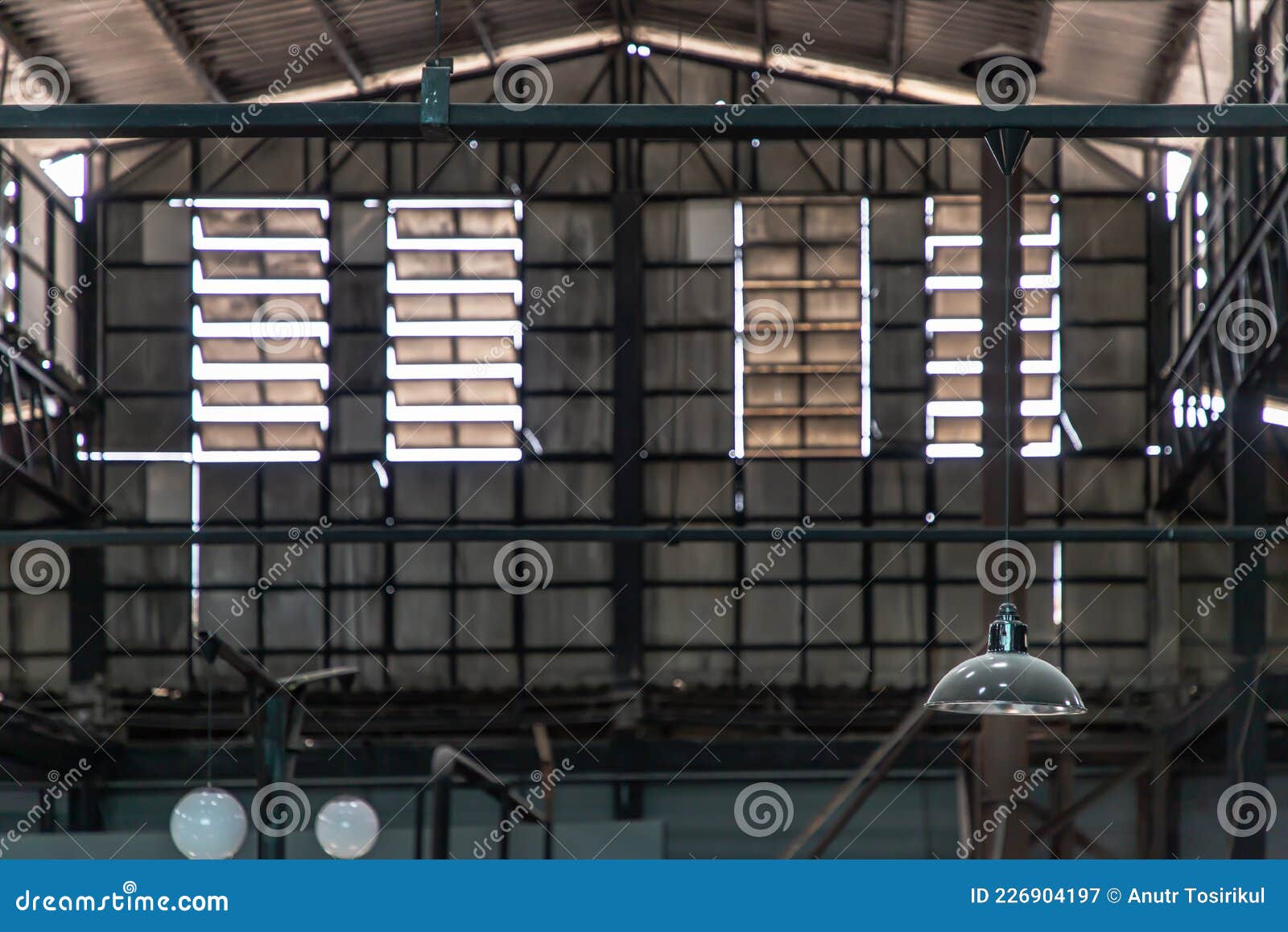 Light Shines through the Vent Shade Wall Inside the Warehouse. for the ...