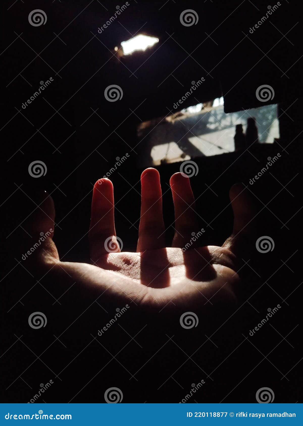 A Light Shining on a Hand in the Dark Stock Image - Image of light ...