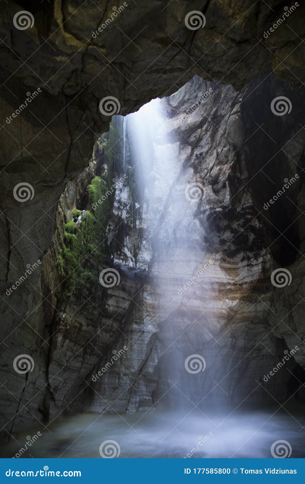 Light Shining through Waterfall in a an Ancient Cave Stock Photo ...