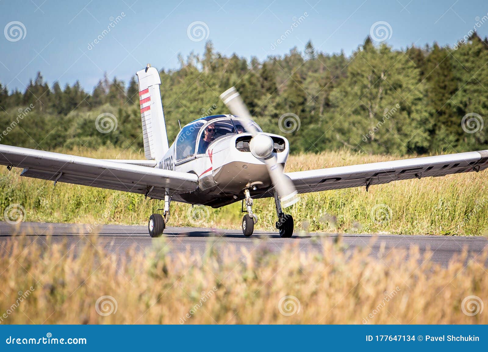 Light Single Engine Aircraft in White Accelerates for Takeoff Editorial ... Light Single Engine Aircraft in White Accelerates for Takeoff Editorial ...