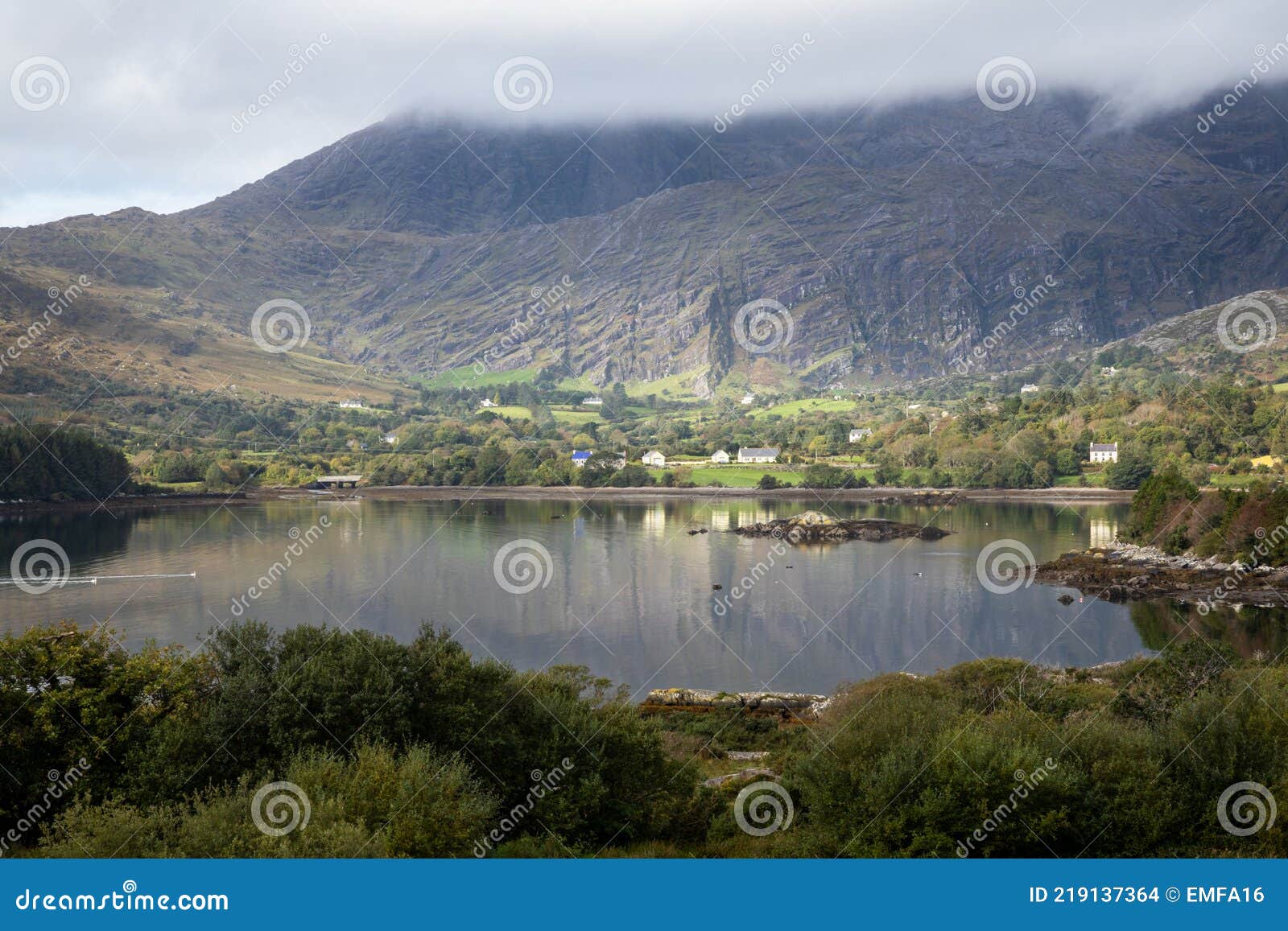 Light Spilling Out of Clouds into Adrigole Harbour, County Cork Stock ...