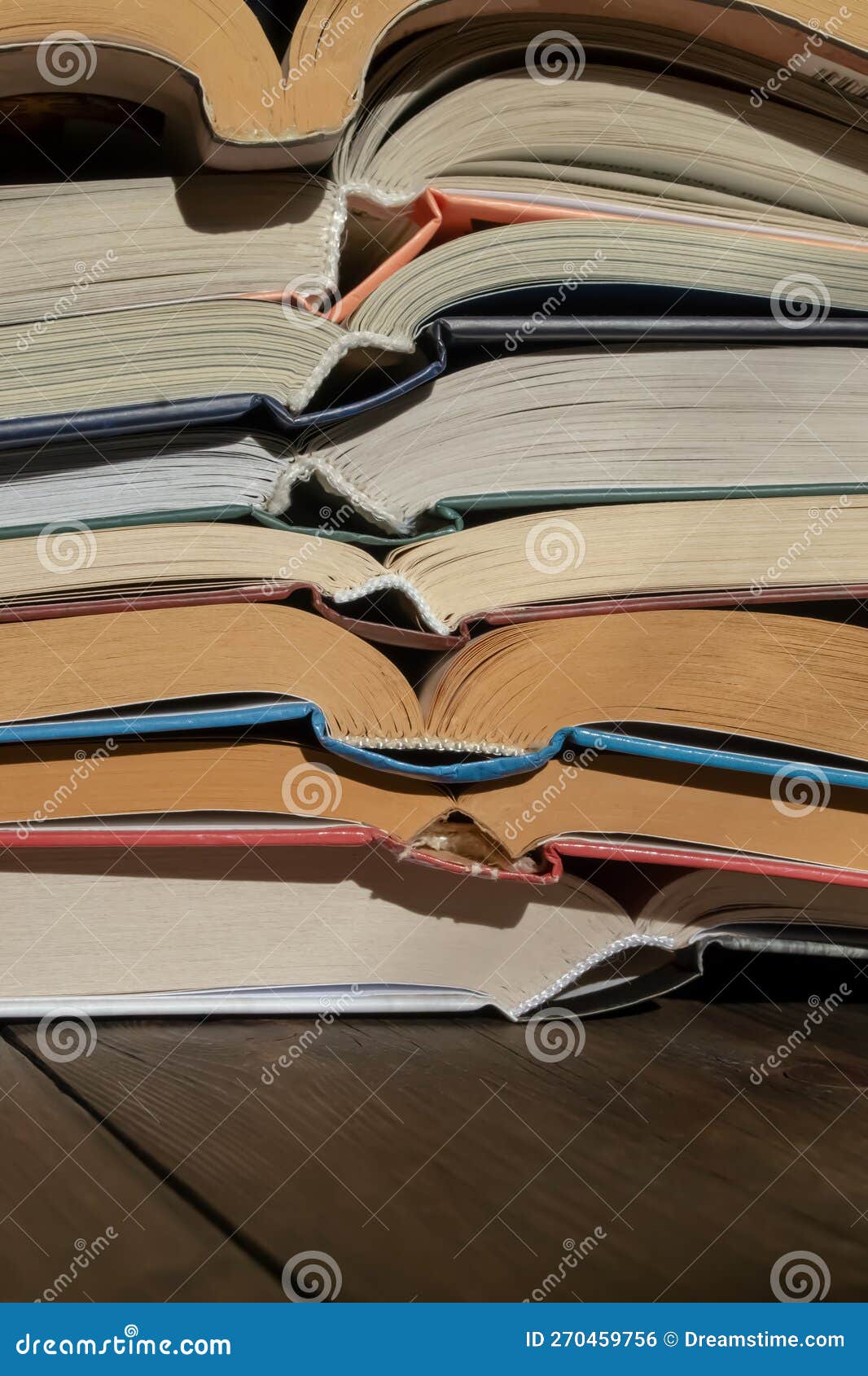 The Light of the Sun Falls on a Stack of Books. Vertical Foto. a Stack ...