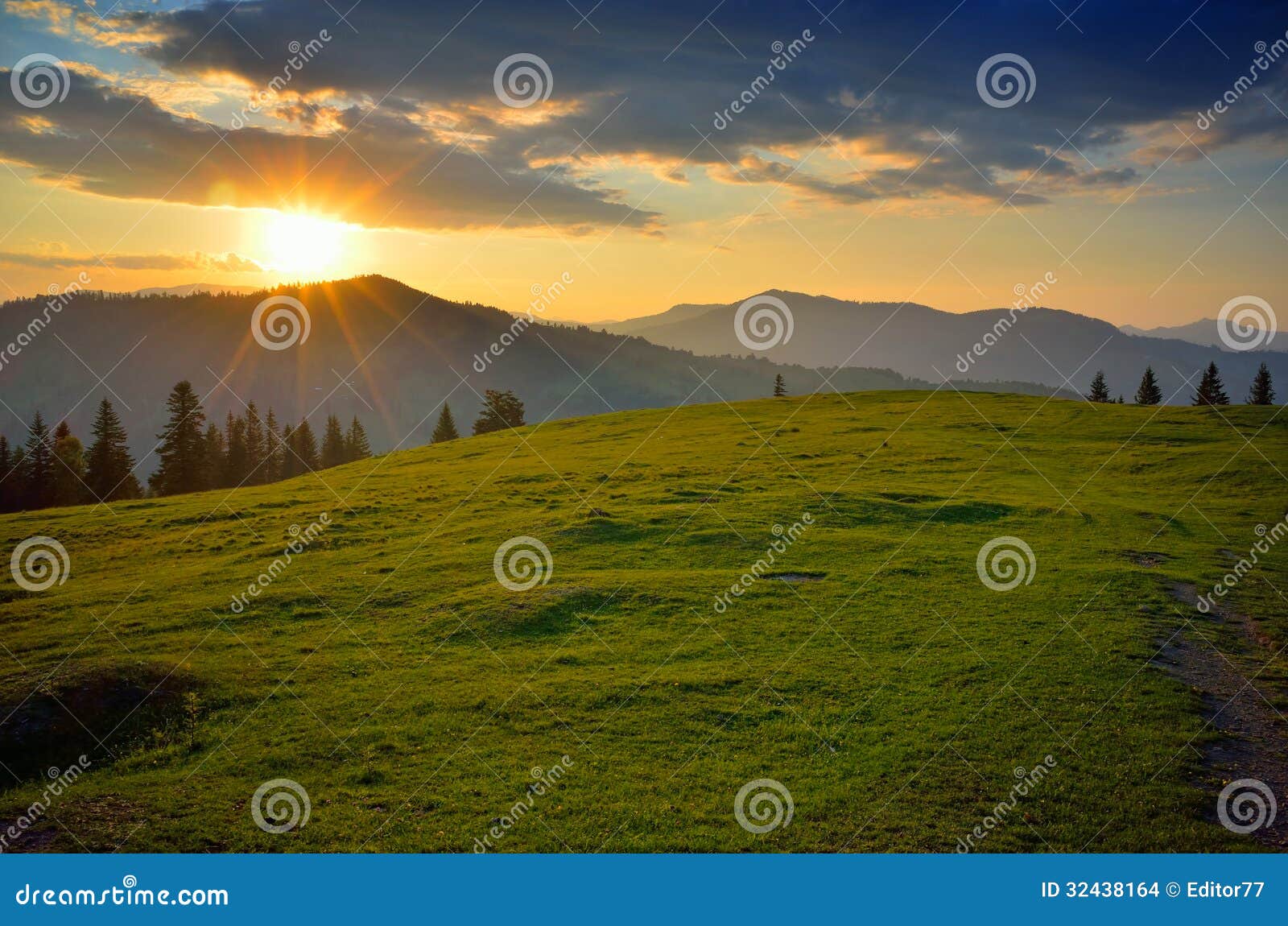 Light of the Sunset Over Grassland Stock Photo - Image of sunset ...