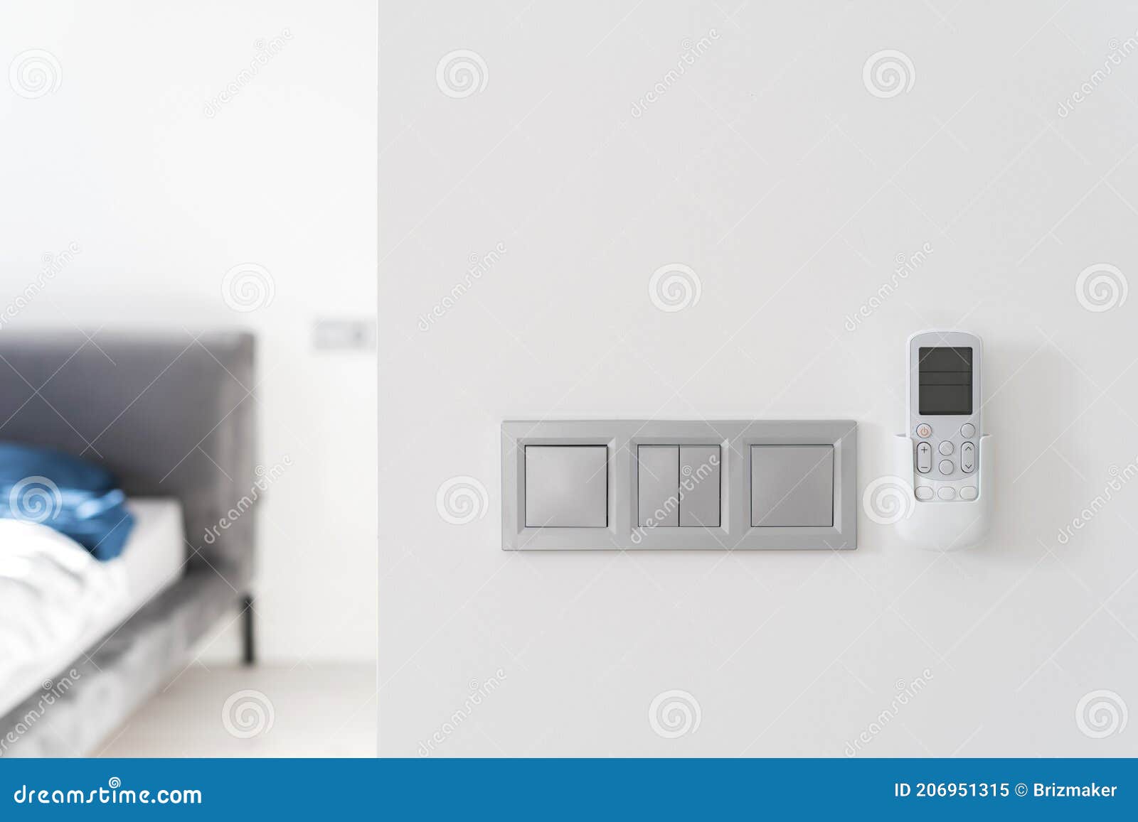 Light Switch and Air Conditioner Controller on Wall Stock Image - Image ...