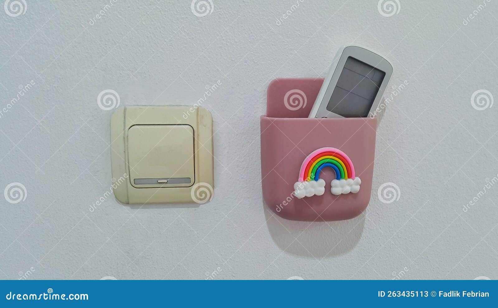 Light Switch and Air Conditioner Remote on White Wall Stock Image ...