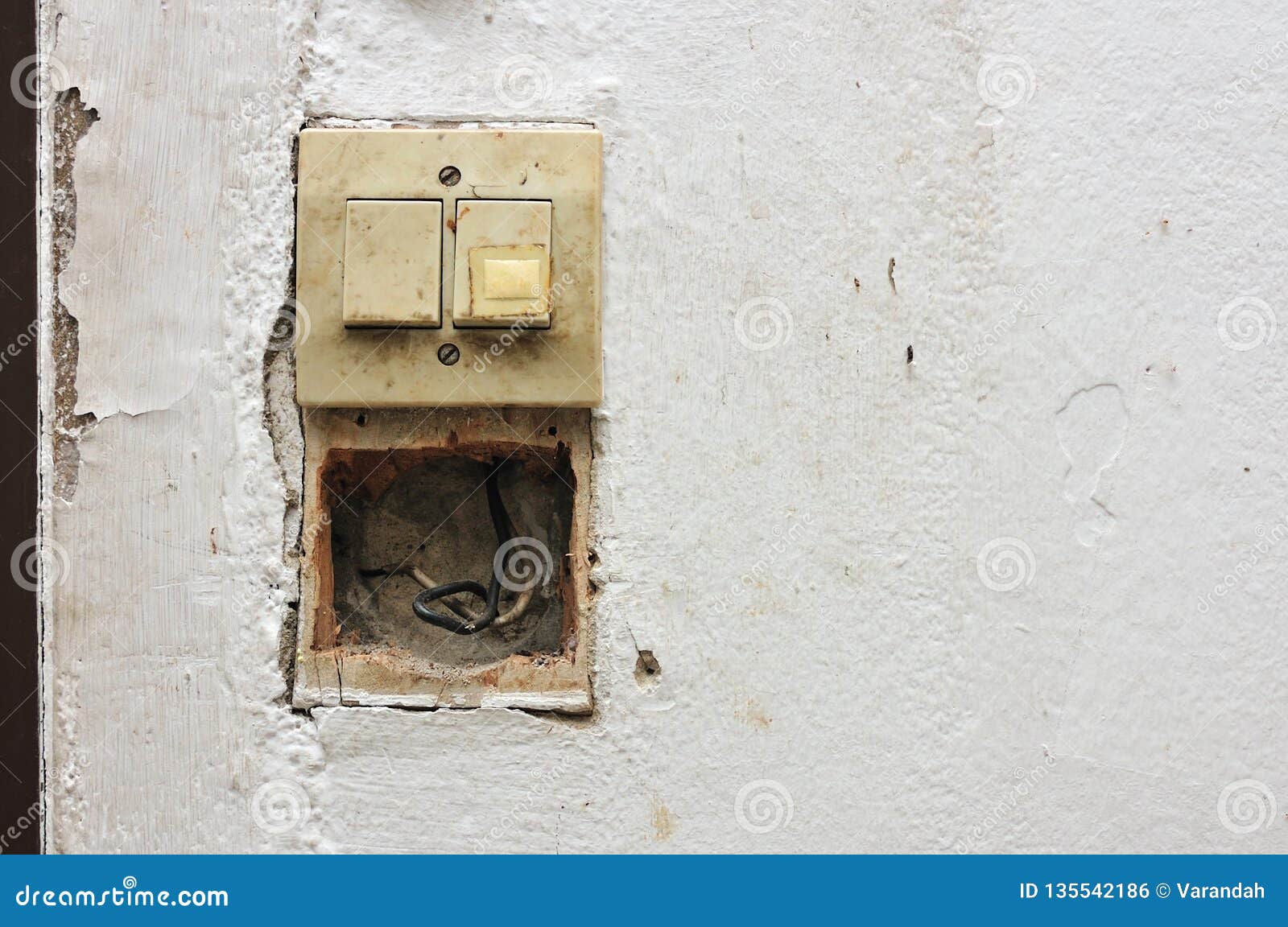 A Light Switch and Electrical Breaker with Damaged Wiring on the Wall ...