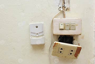 A Light Switch and Electrical Breaker with Damaged Wiring on the Wall ...