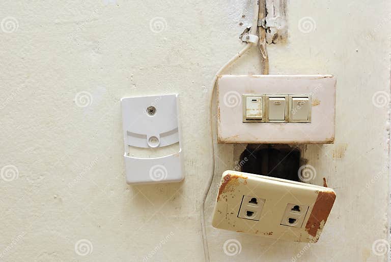 A Light Switch and Electrical Breaker with Damaged Wiring on the Wall ...