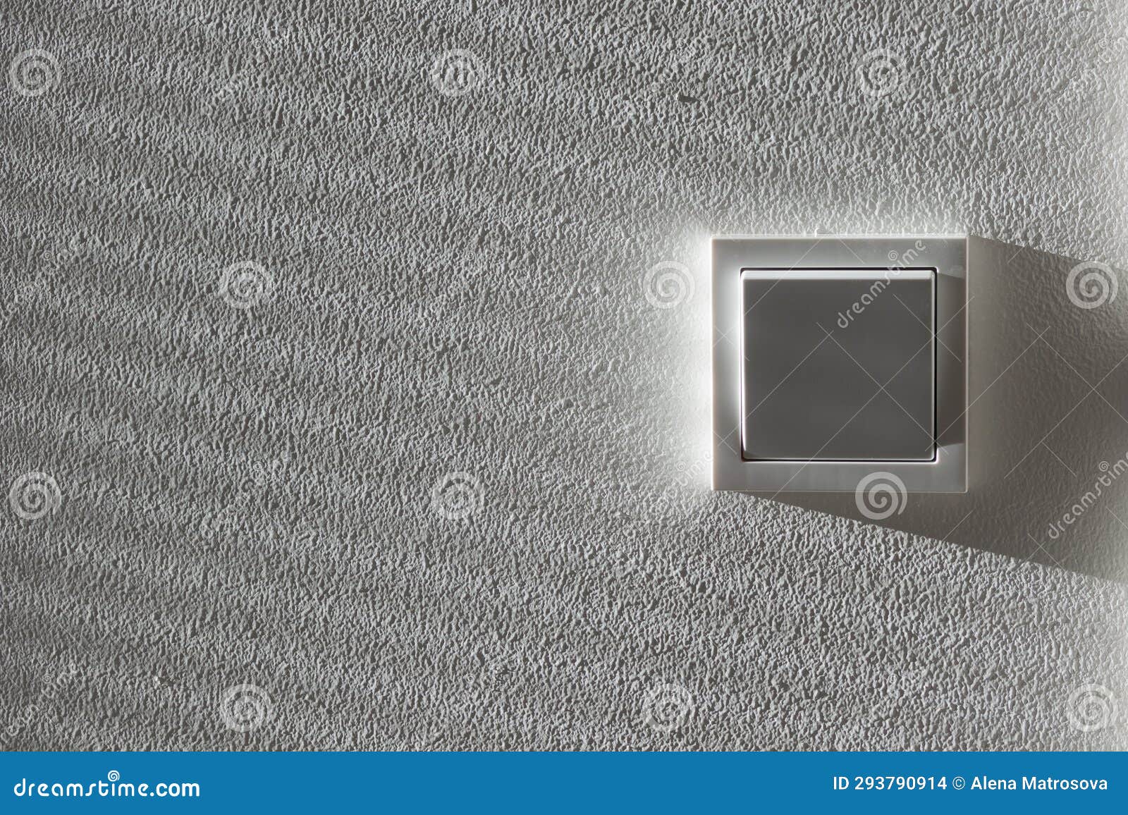 Light Switcher on the White Wall Beneath Rays of Light Stock Photo ...