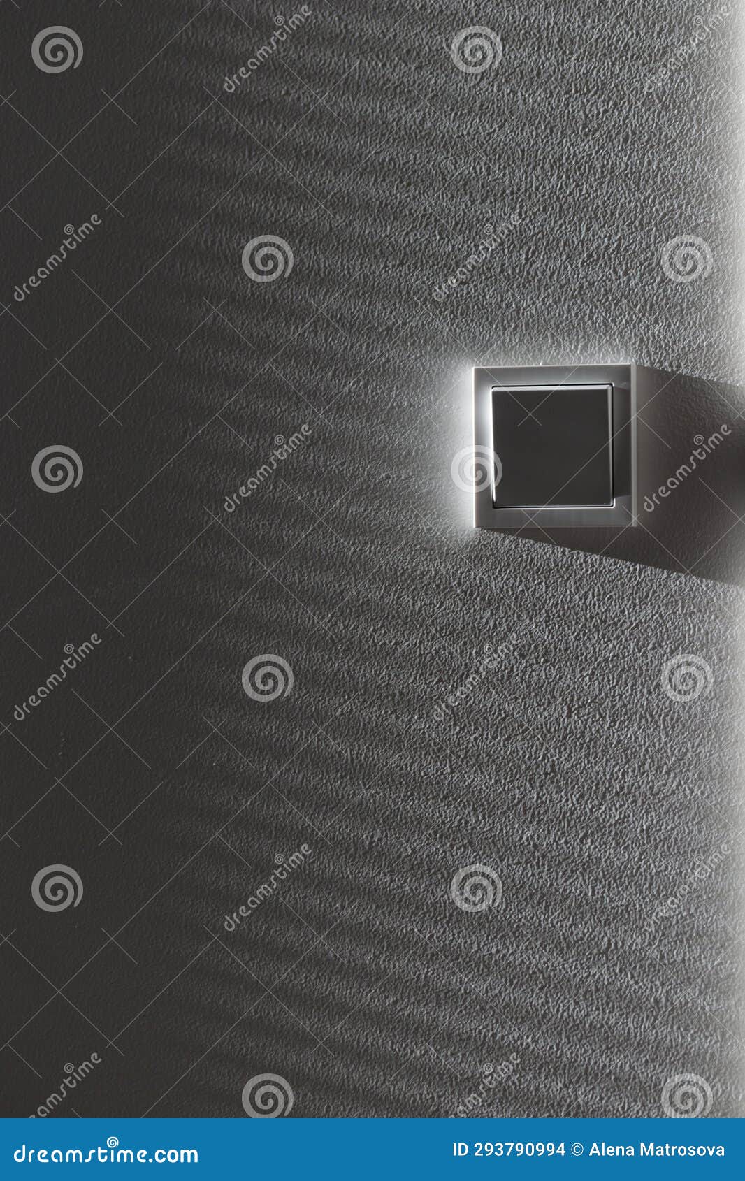 Light Switcher on the White Wall Beneath Rays of Light Stock Photo ...