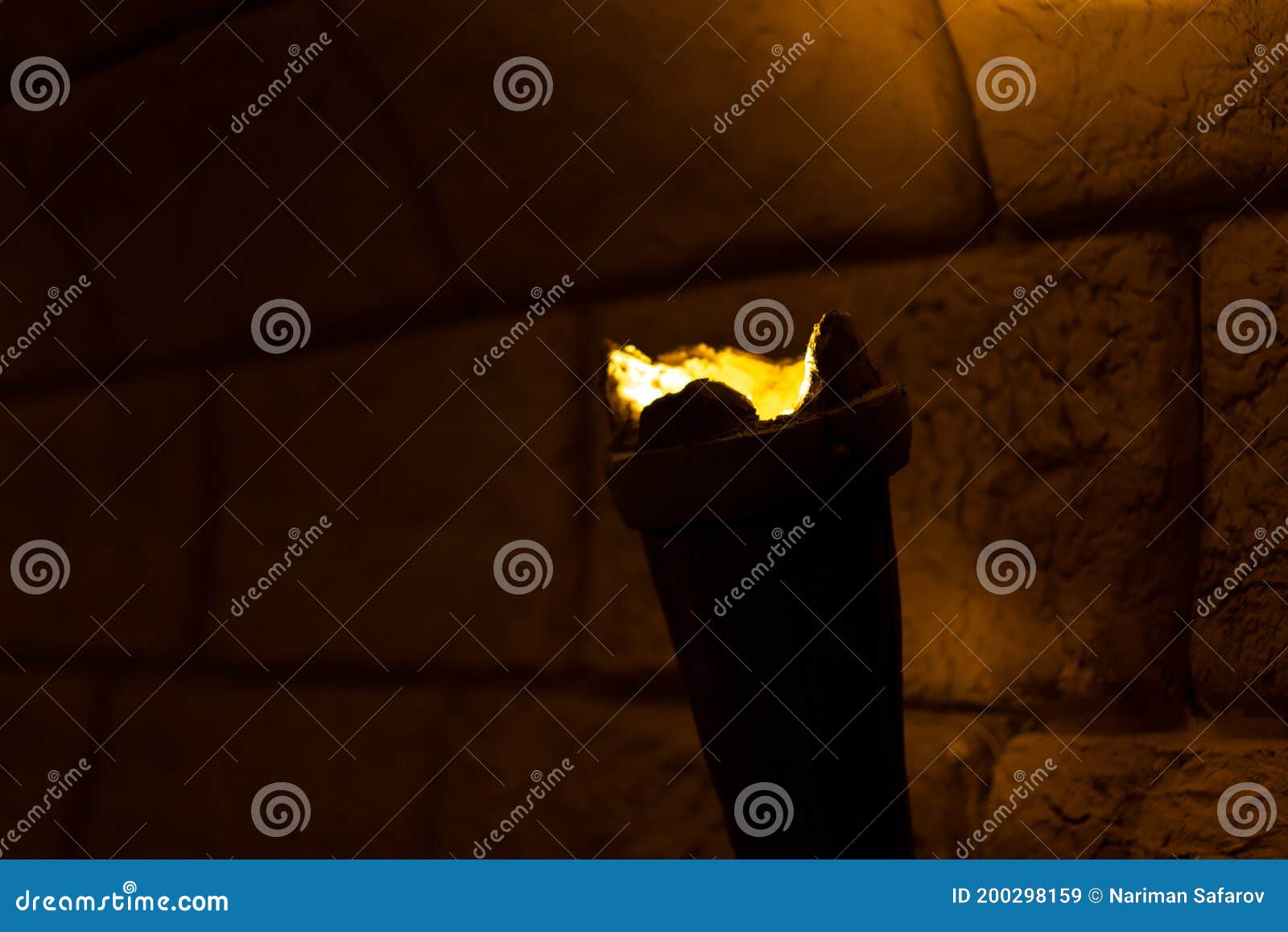 Light from a Torch in a Cave Stock Image - Image of mystical, gatherer ...