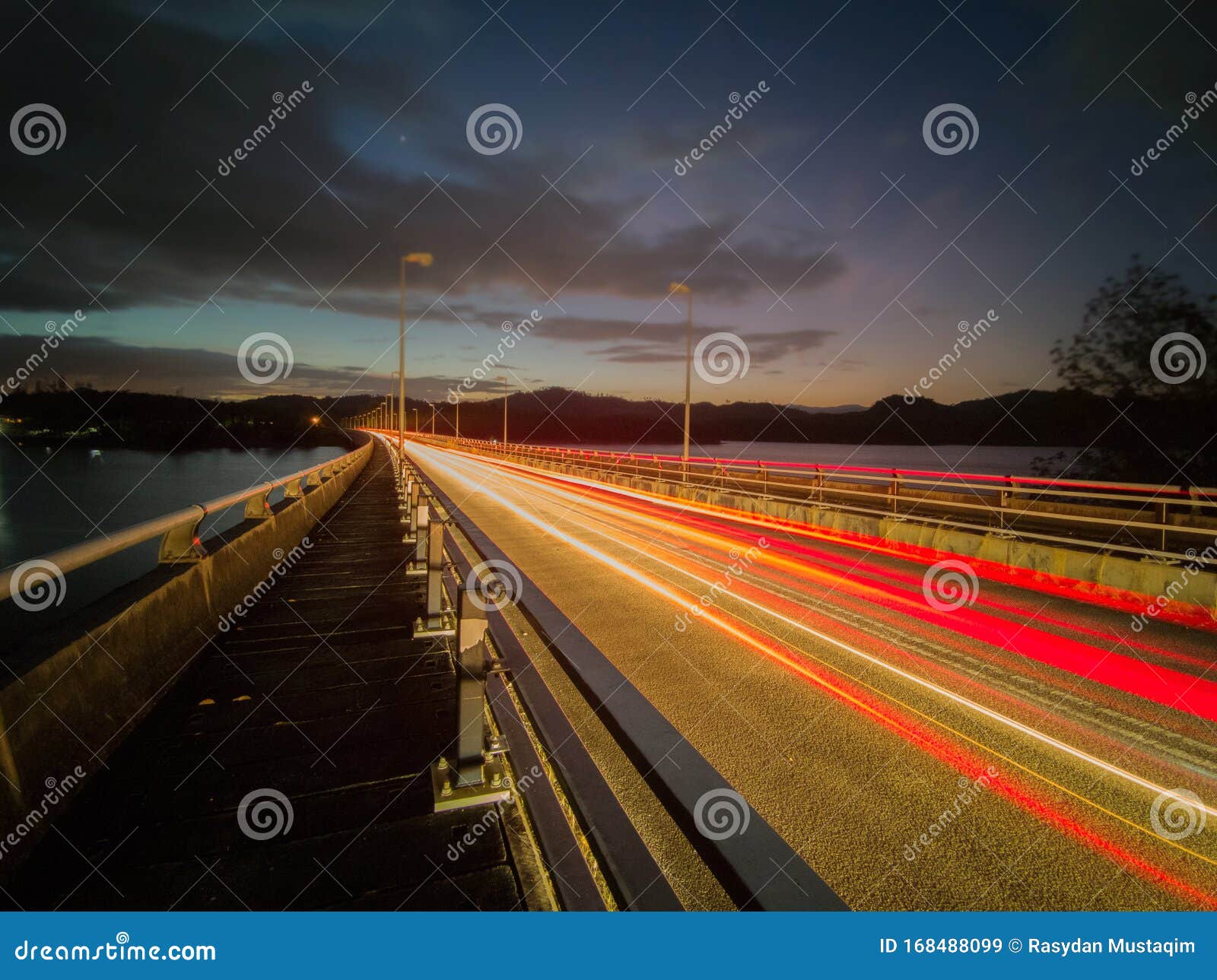 Light Trails Across the Bridge with a Blue Sky Stock Image - Image of ...