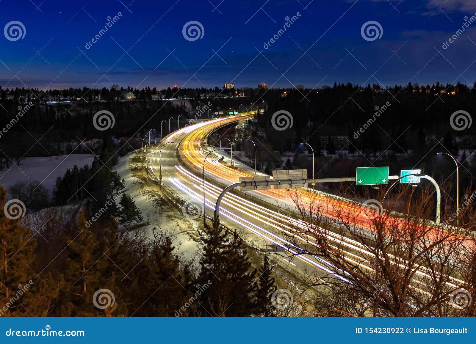 Light Trails Under a Night Sky Stock Photo - Image of urbanskyline ...
