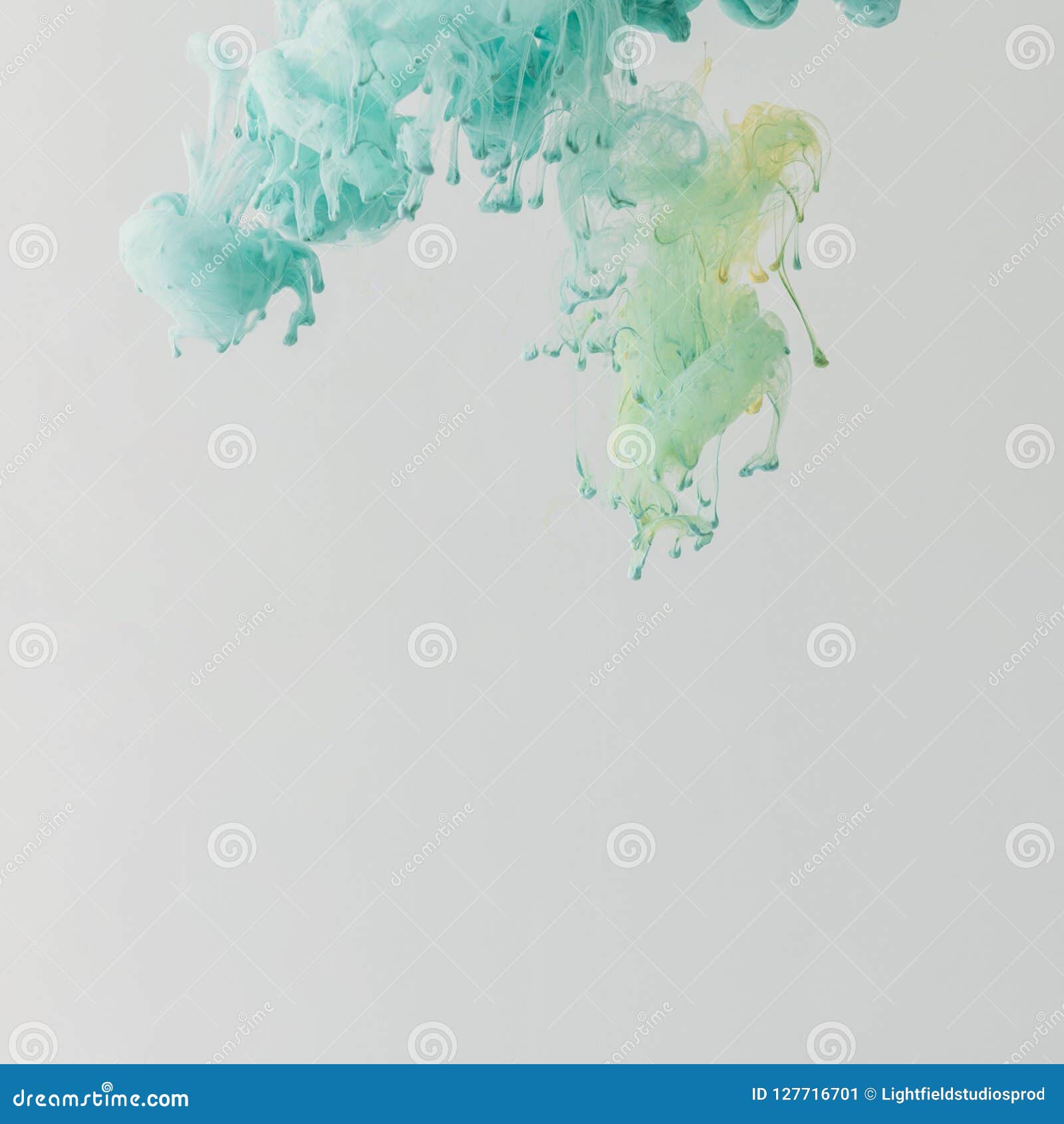 Light Turquoise Paint Flowing in Water with Drops, Isolated on Grey ...