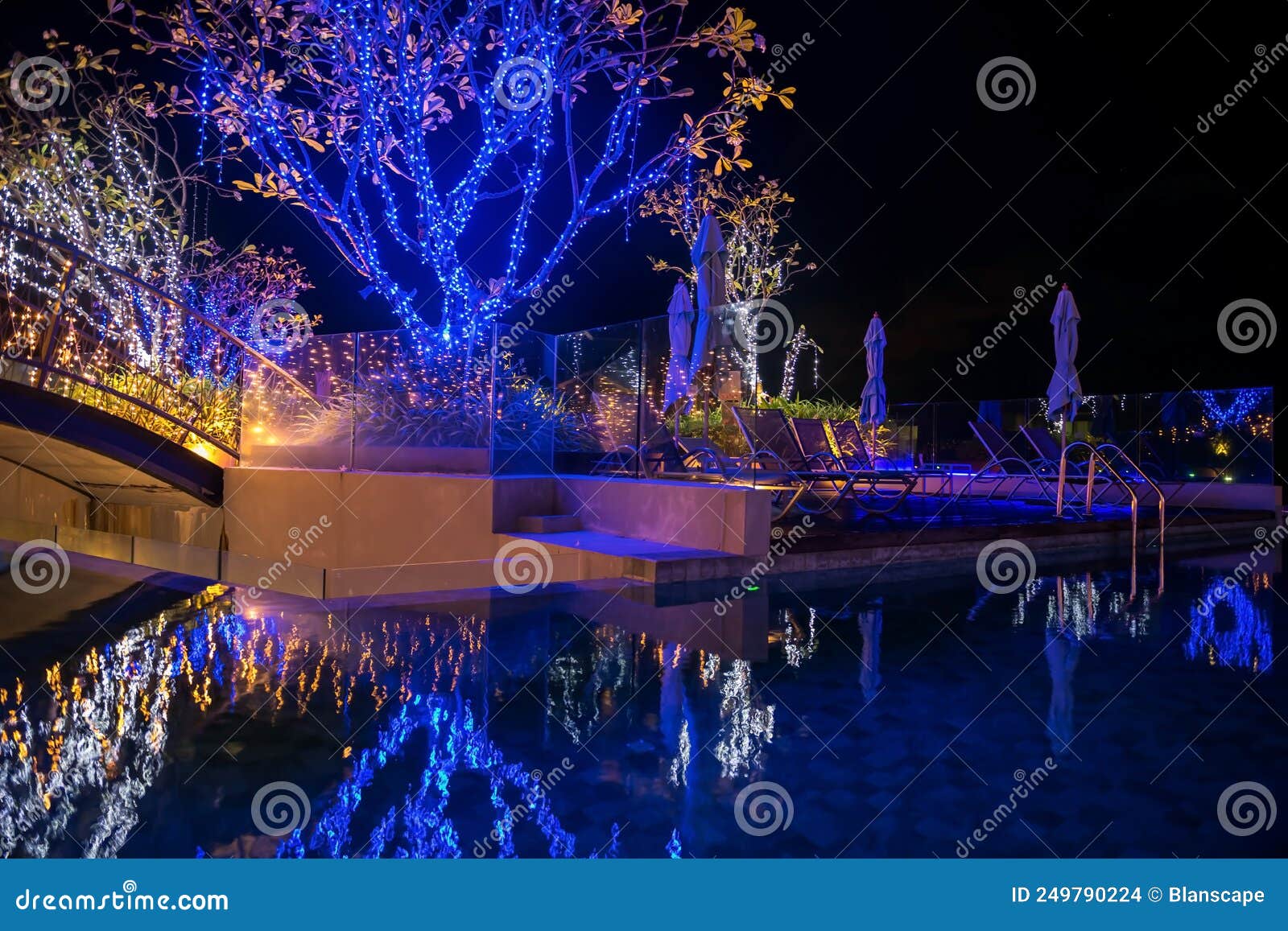 Light Up Decoration on Bridge and Trees at Night Pool Stock Photo ...