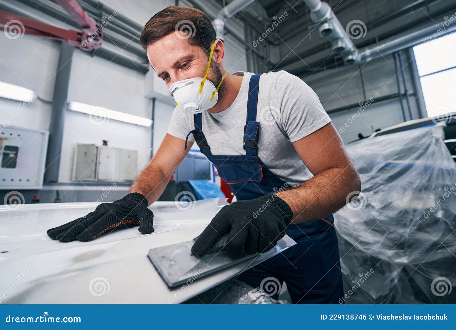 Man Sanding White Car Part with Hand Instrument Stock Photo - Image of ...