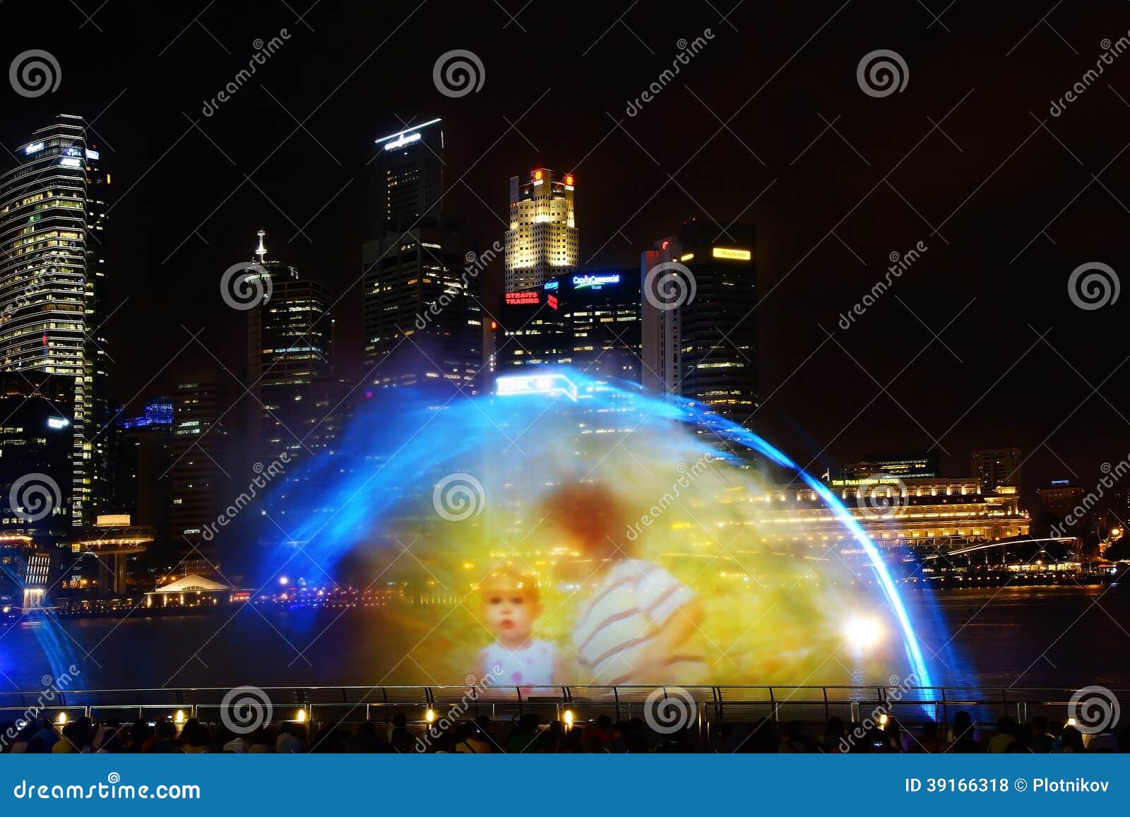 Water Show In The Pool And Night View Of The Skylines Near The Burj ...