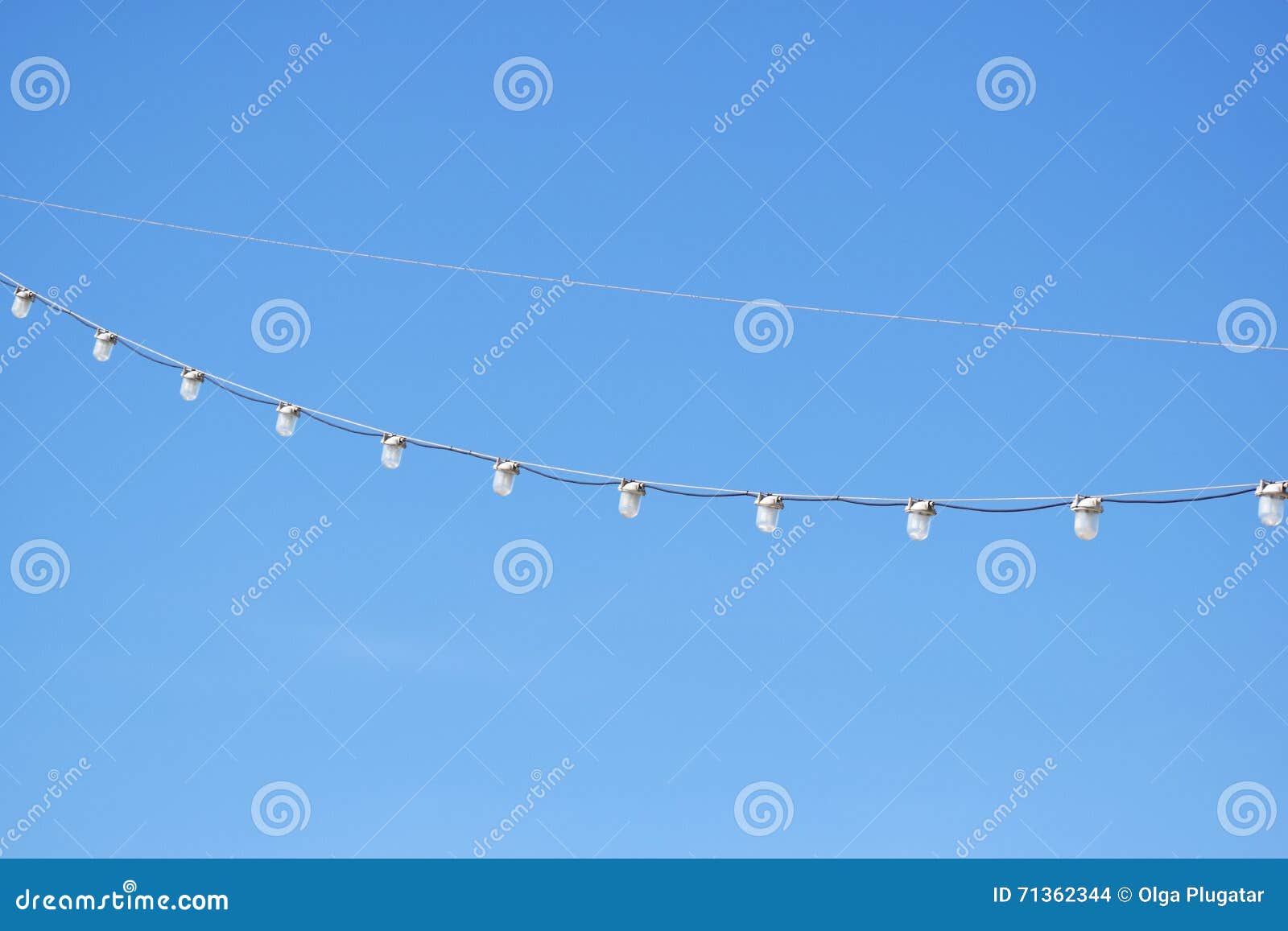 Light White Bulbs Hanging on Electricity Wire in Clear Blue Sky Stock ...