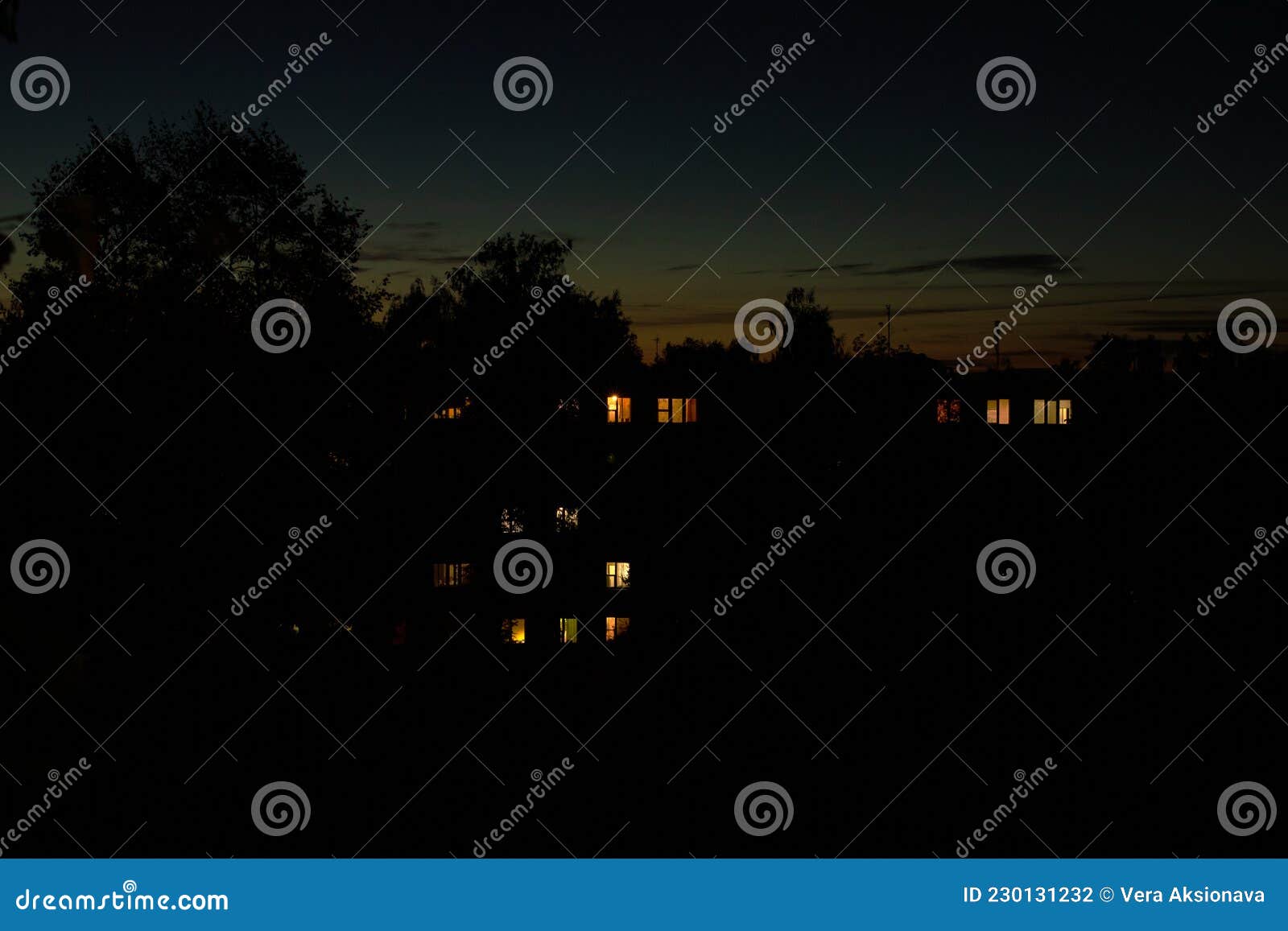 Light in Windows of Building at Sunset Stock Photo - Image of glow ...