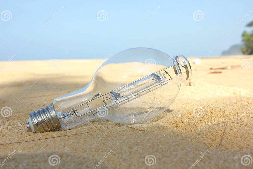 Lightbulb on beach stock photo. Image of discovery, energy - 22409248