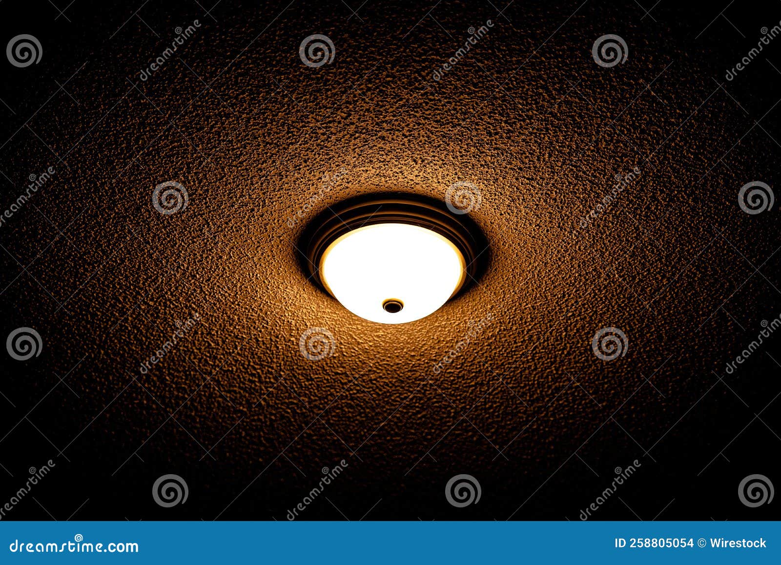 Lightbulb on a Ceiling with Rough Background in a Dark Room Stock Photo ...