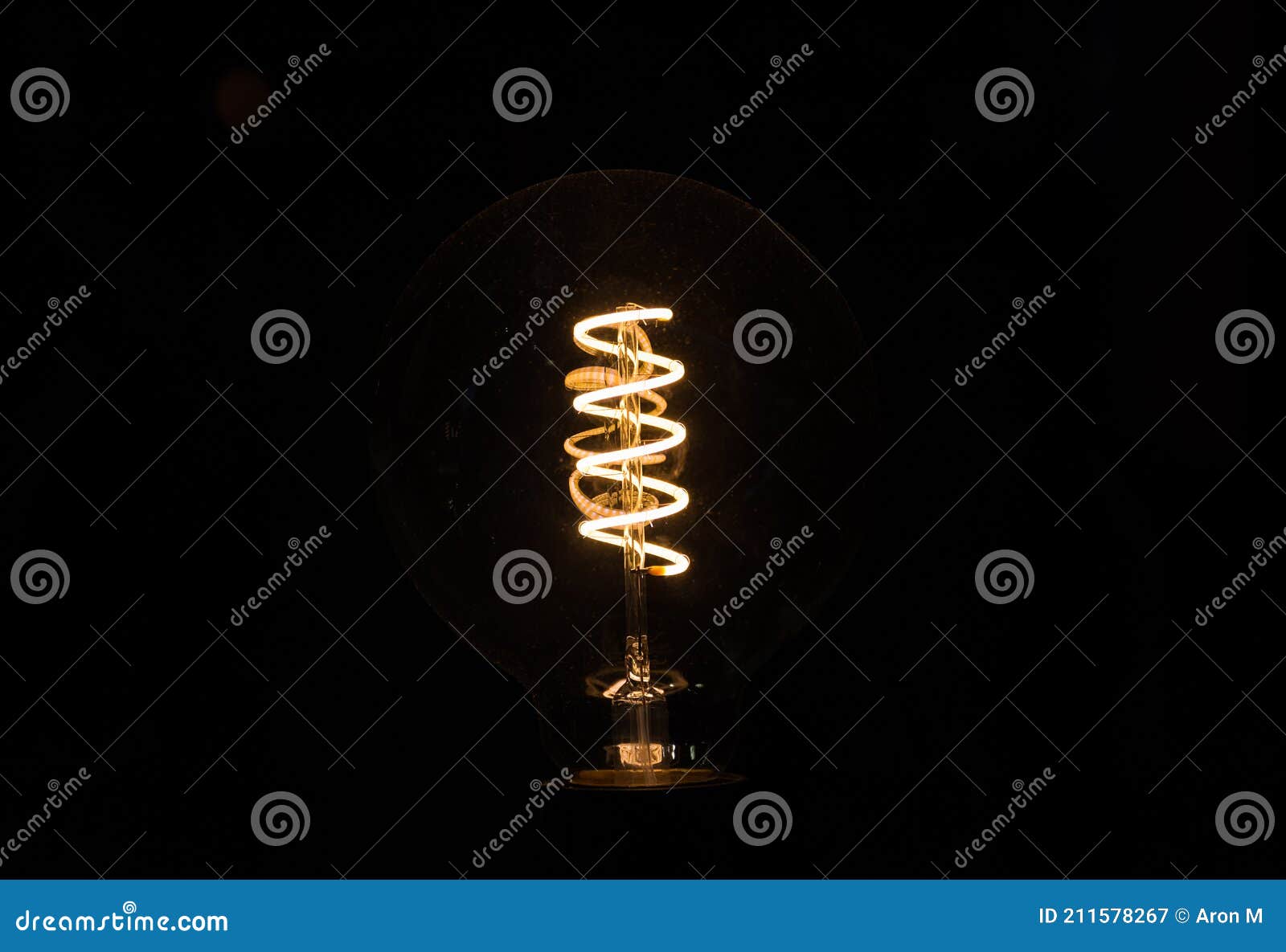 Lightbulb on Dark Background with Bright Spiral Wire Stock Image ...