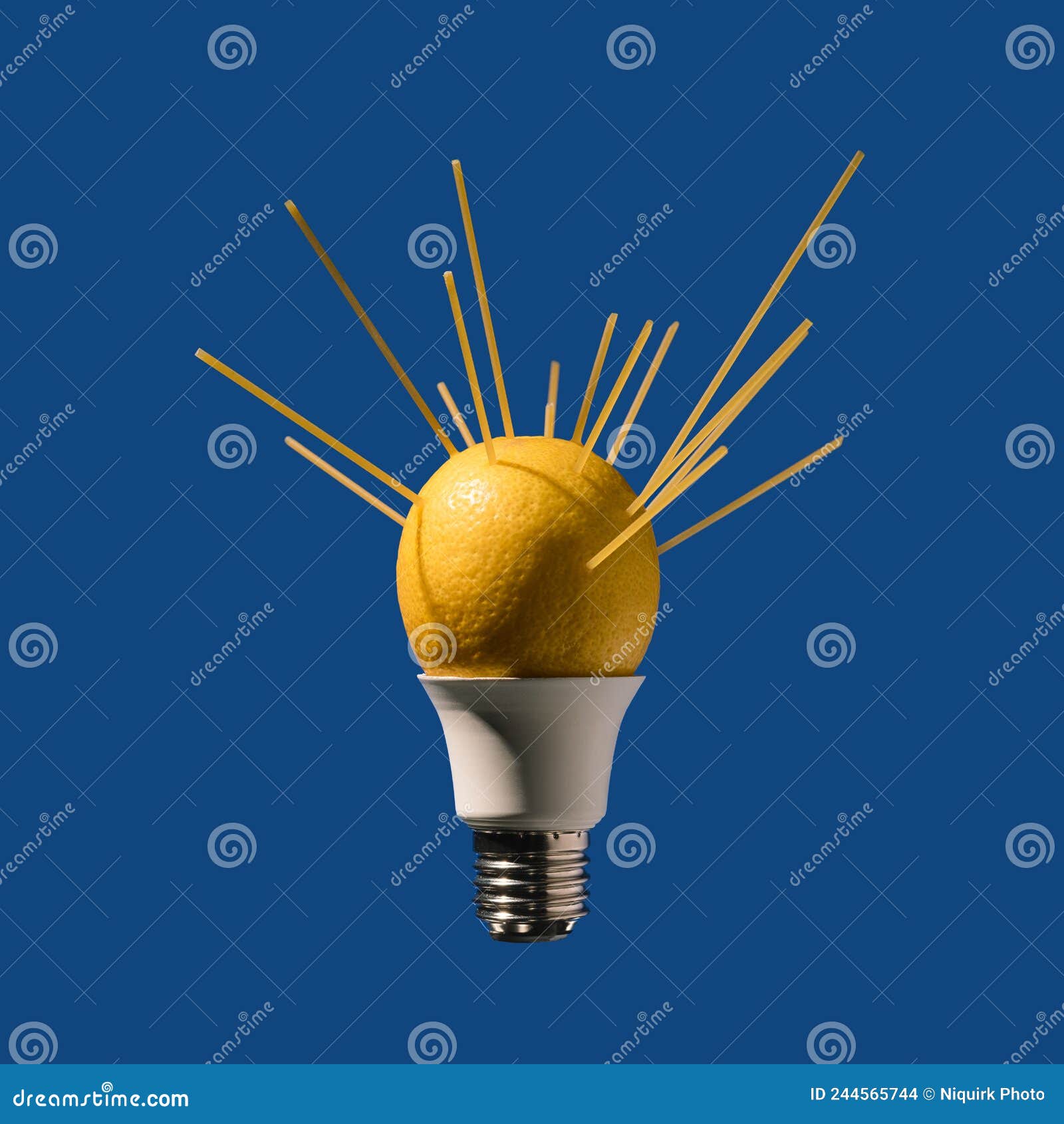 Lightbulb with Lemon and Spaghetti Light Rays on a Blue Background ...