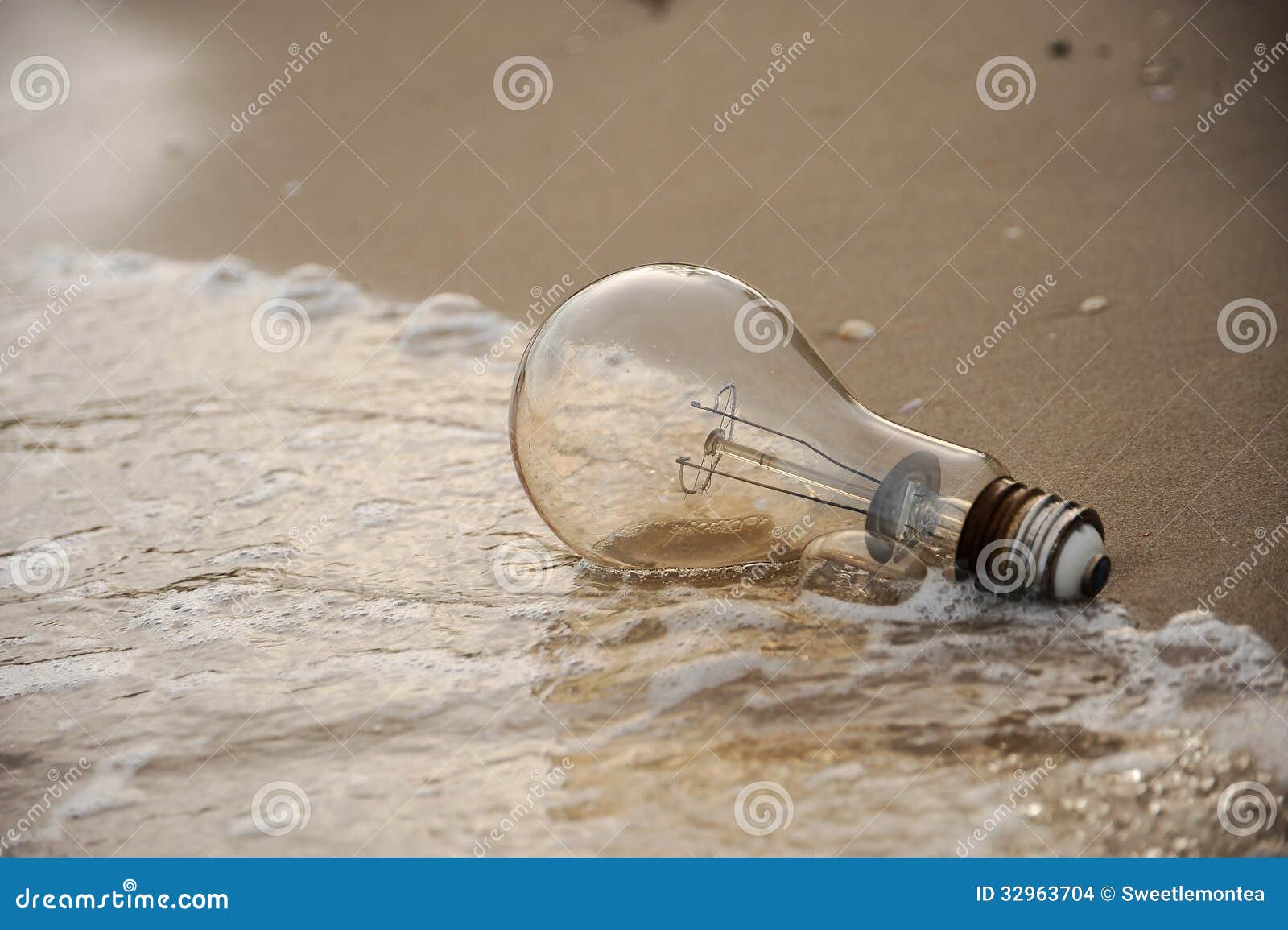 Lightbulb on sand stock photo. Image of technology, closeup - 32963704
