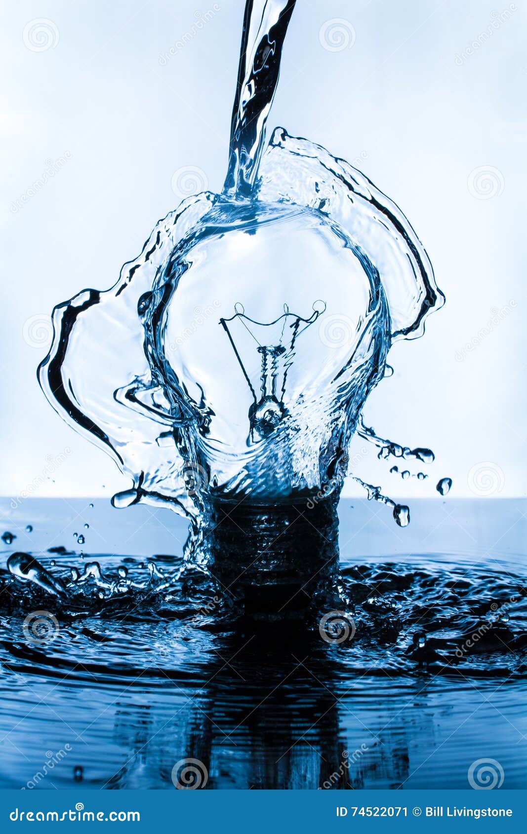 Lightbulb Splashed with Water on Dark Surface with Blue Hue Stock Image ...