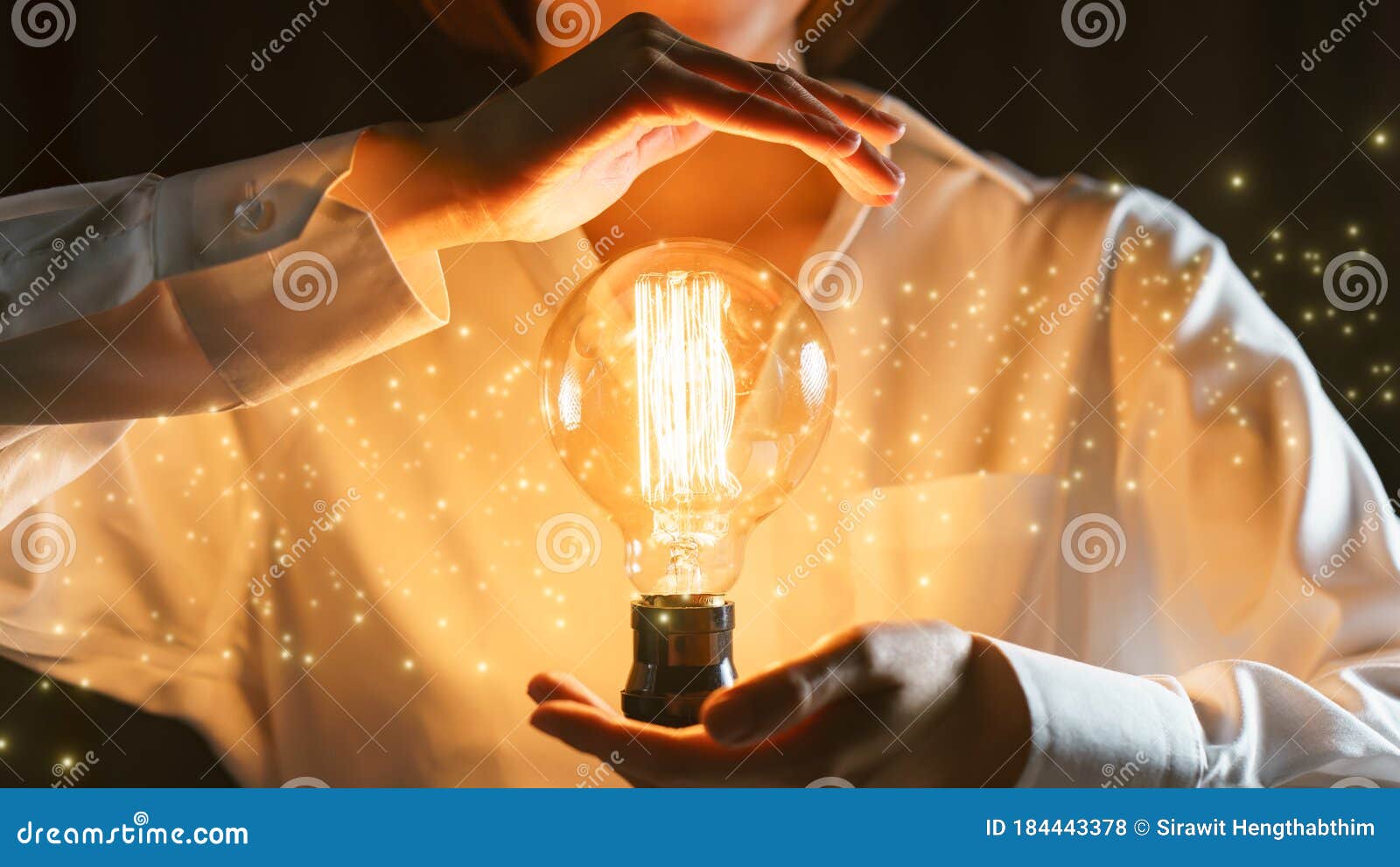 Lightbulb between Two Hands As a Symbol of Ideas Stock Photo - Image of ...