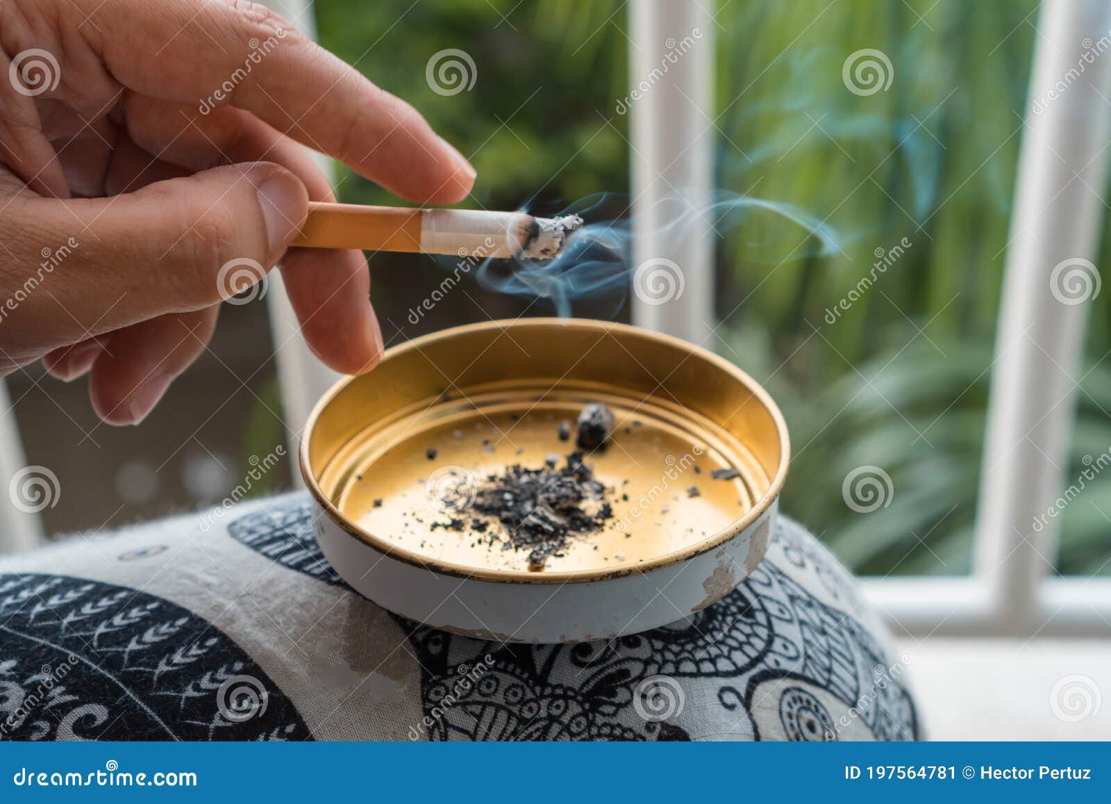 Lighted Cigarette in a Golden Ashtray Stock Image - Image of golden ...