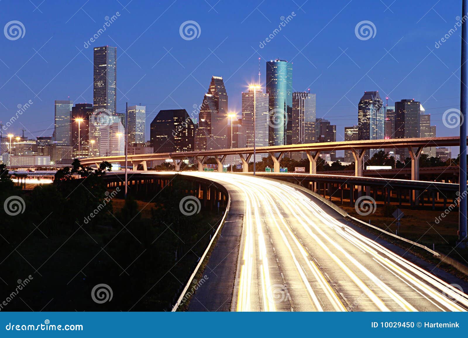 Lighted Houston Skyline Against Blue Sky Stock Photo - Image of dusk ...