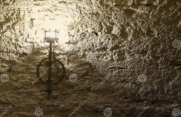 Lighted Medieval Castle Torch Hanging on a Stone Wall, Vintage Objects ...