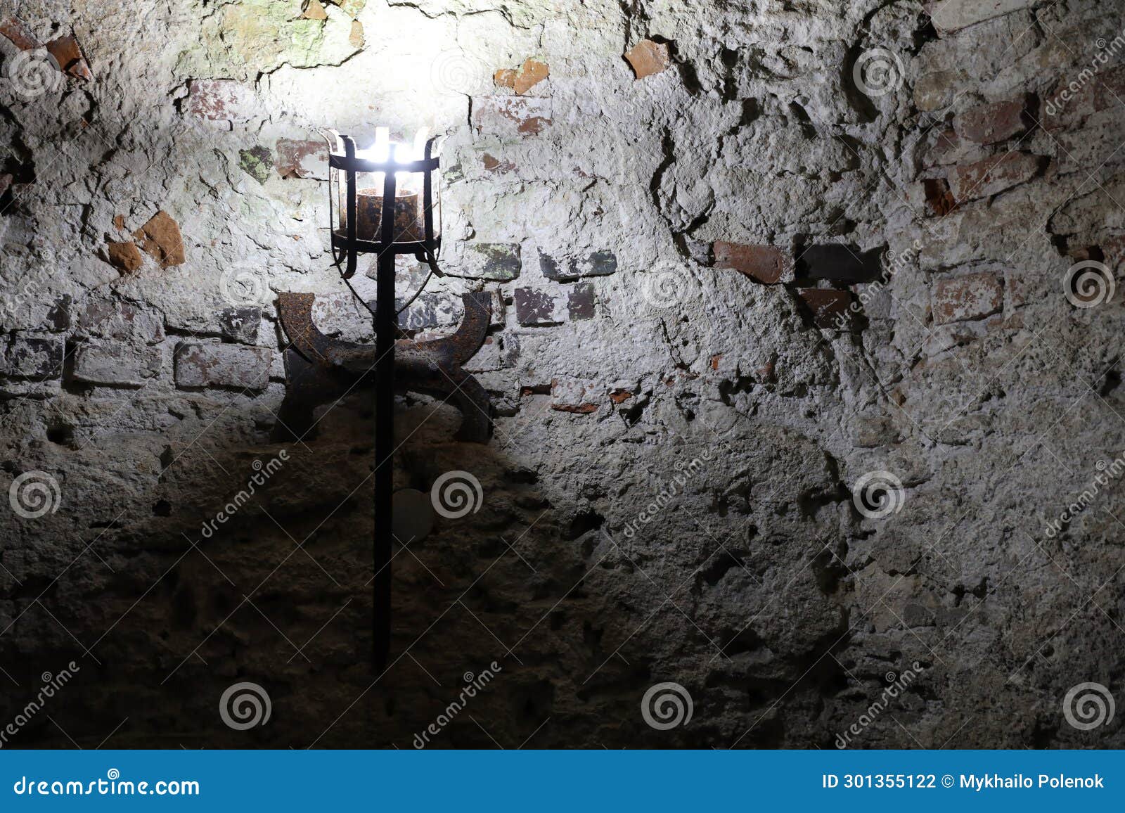 Lighted Medieval Castle Torch Hanging on a Stone Wall, Vintage Objects ...