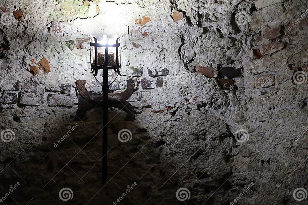 Lighted Medieval Castle Torch Hanging on a Stone Wall, Vintage Objects ...