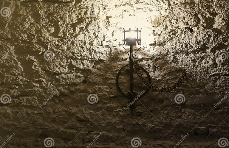 Lighted Medieval Castle Torch Hanging on a Stone Wall, Vintage Objects ...