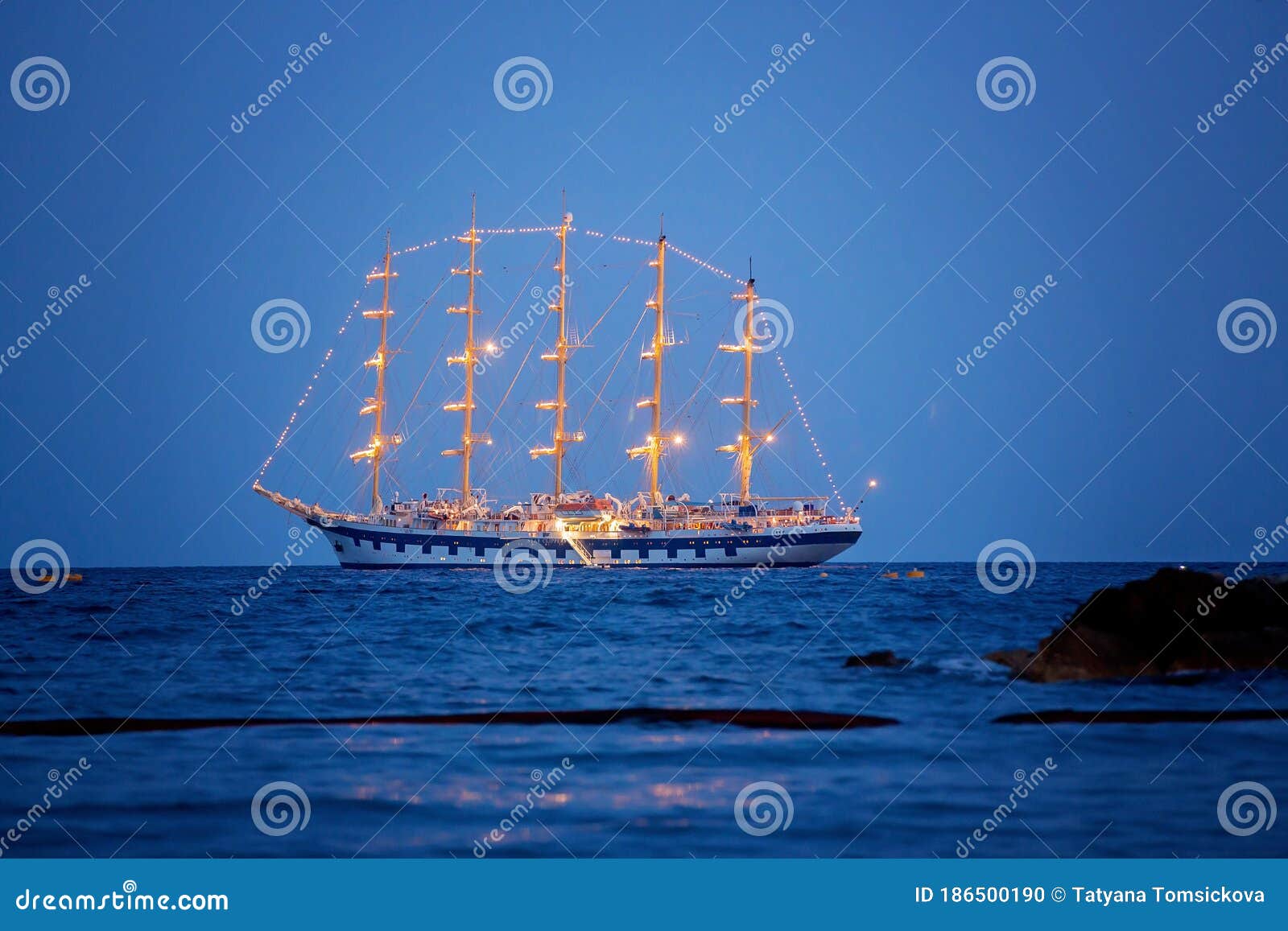 Lighted Ship in the Ocean on Sunset Stock Photo - Image of conversation ...