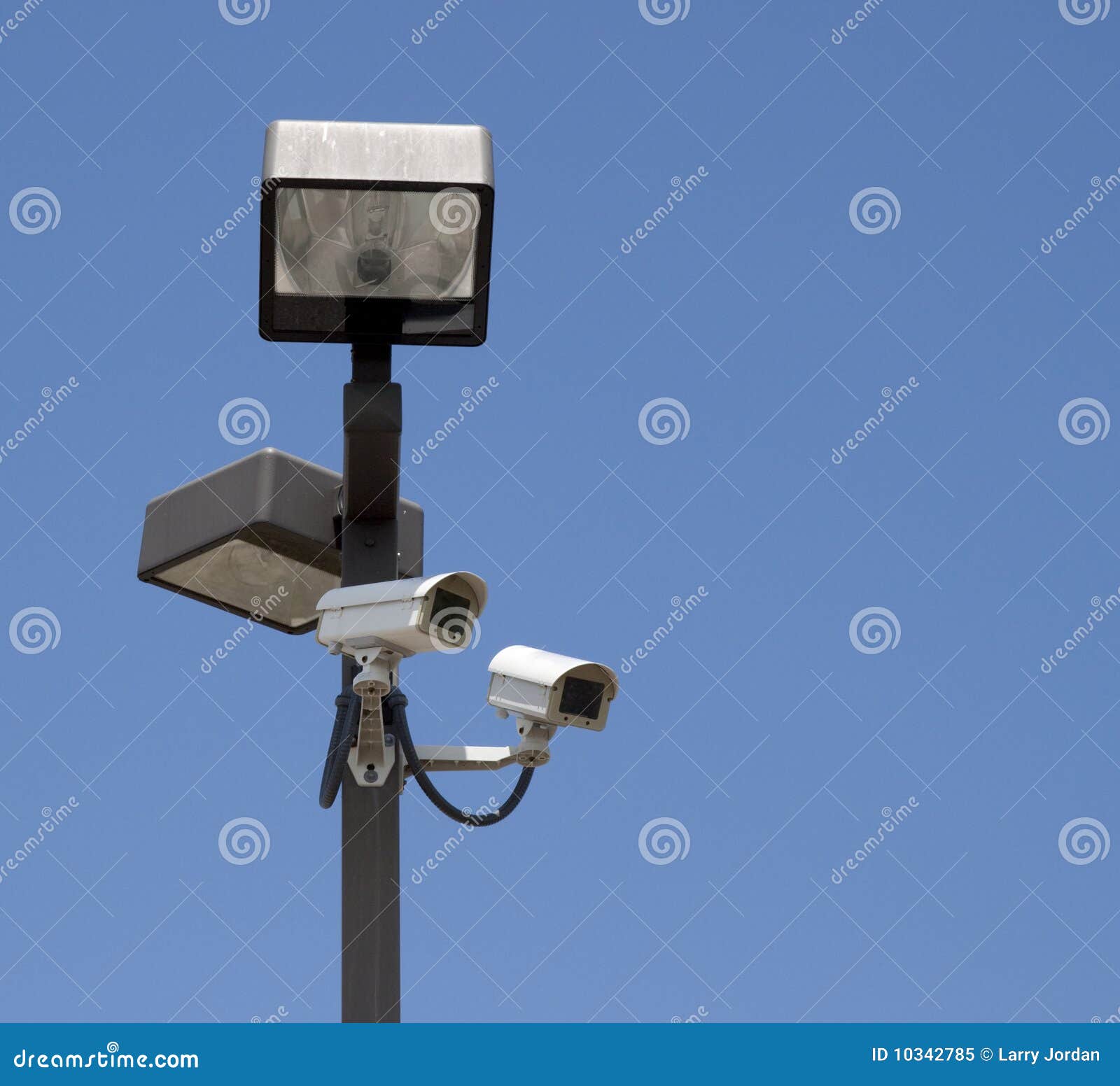 Lighted Surveillance Cameras on Pole Stock Image - Image of floodlights ...