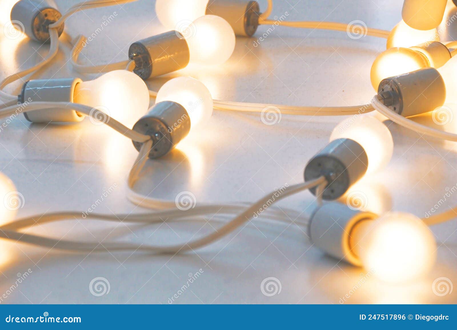 Lighted White Bulbs Joined by a Continuous Cable Stock Photo - Image of ...