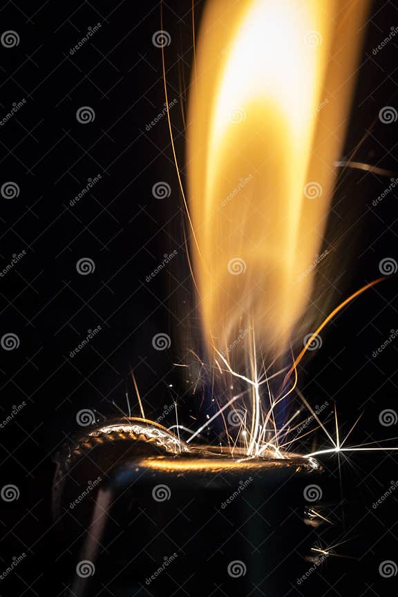 A Lighter Being Lit in the Dark Stock Photo - Image of detail, crystal ...