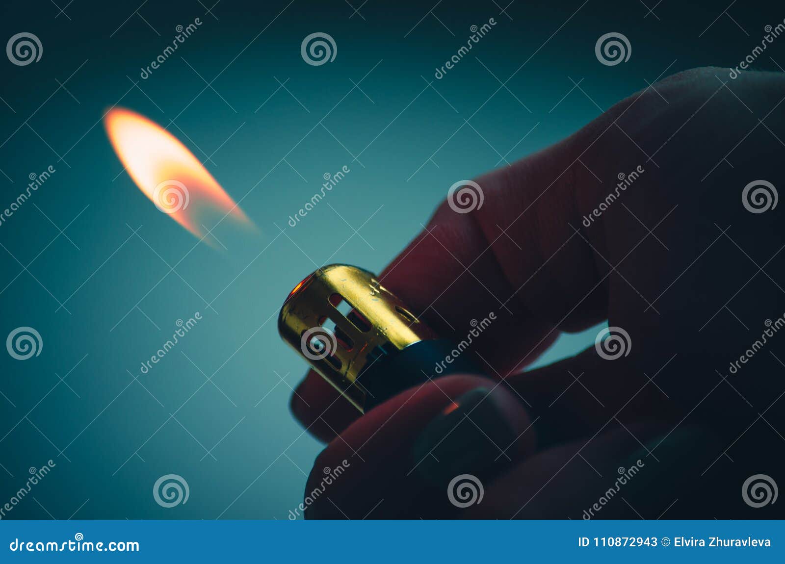 Lighter Finger Burning Fire on Green Blue Background Stock Image ...