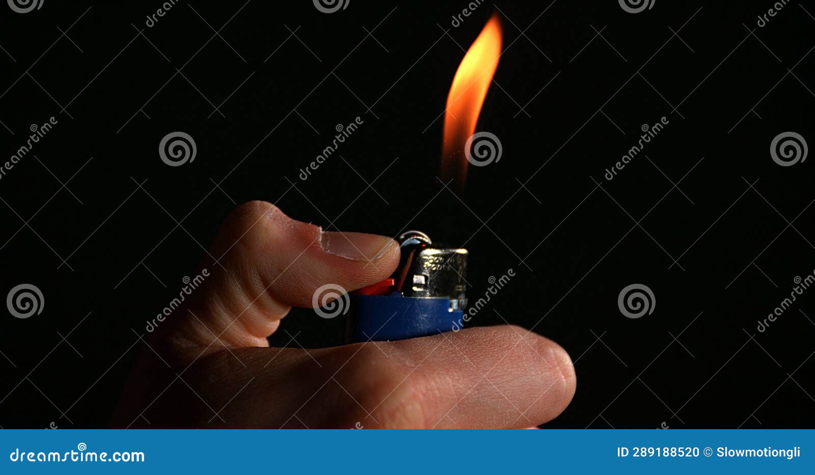 Lighter in Hand with Flame Against Black Background Stock Photo - Image ...