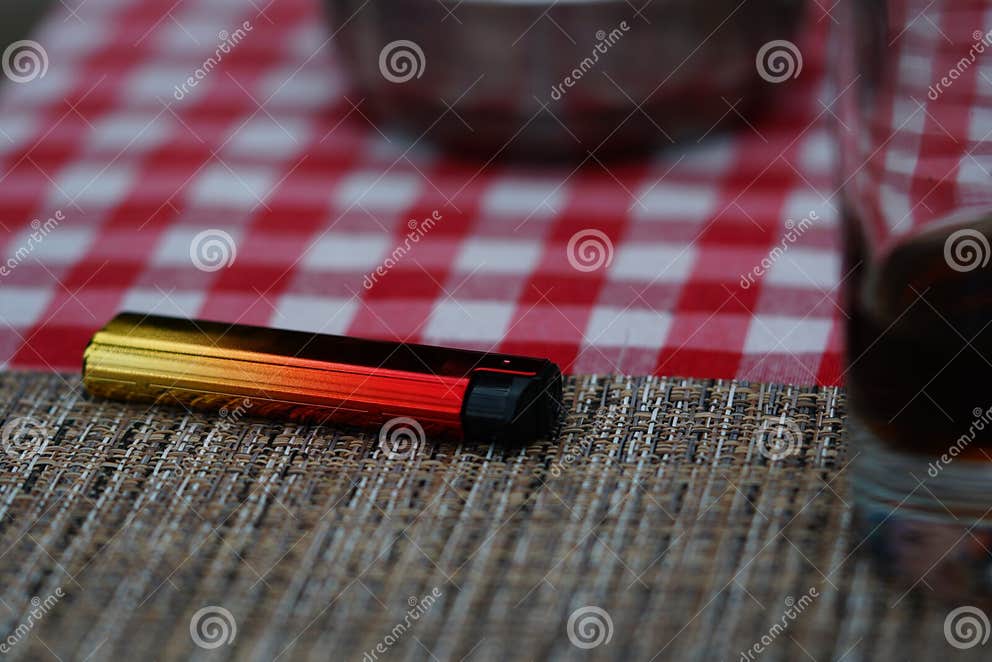 Lighter on a table stock image. Image of ovidiu, glasses - 233609567