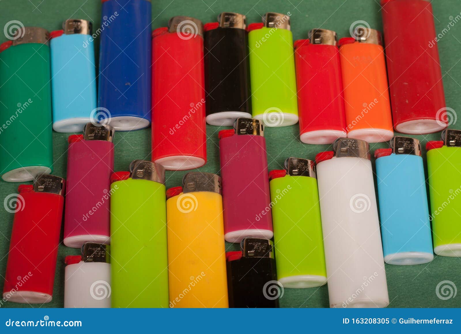 Lighters on a Green Background Stock Image - Image of metal, disposable ...