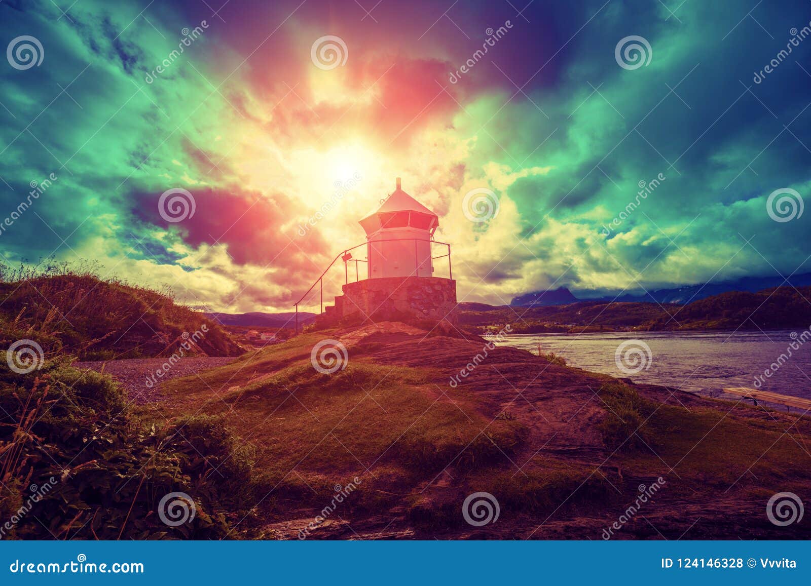 Lighthouse Against Dramatic Cloudy Sky during Sunset Stock Photo ...