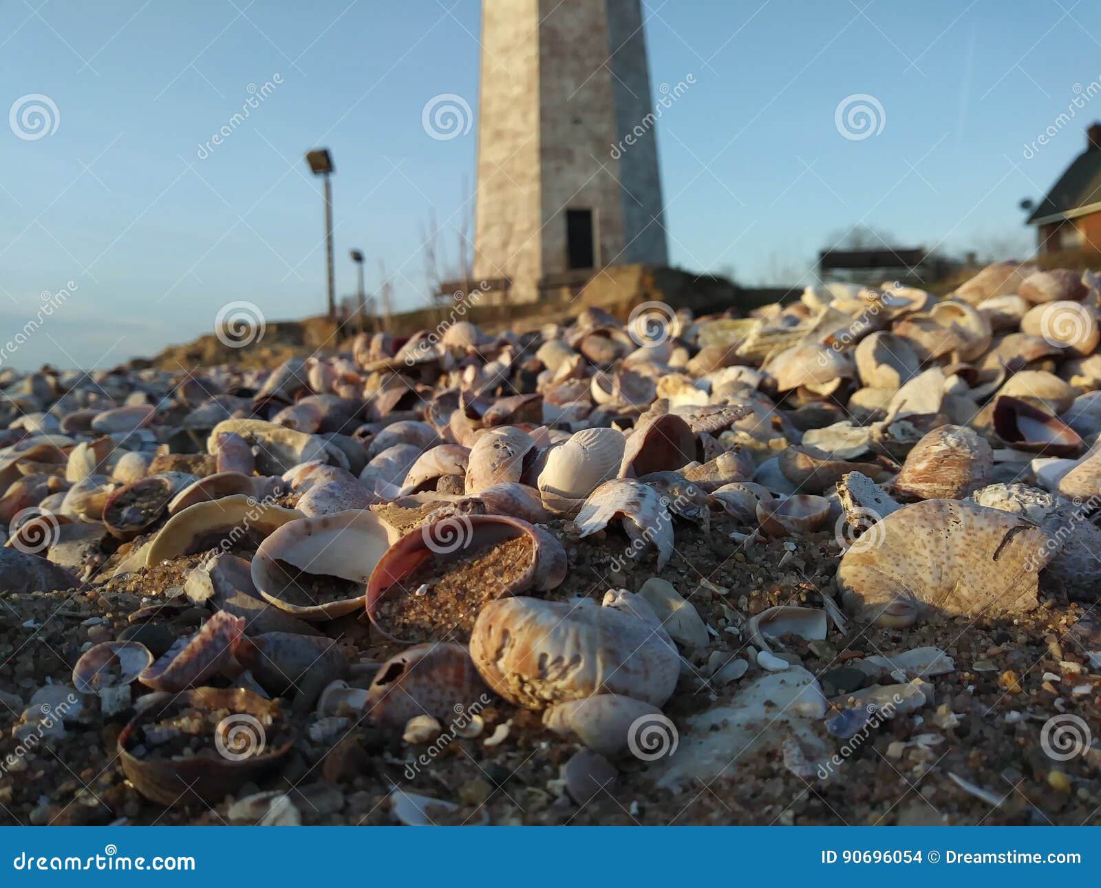 Lighthouse stock photo. Image of shells, lighthouse, rocks - 90696054