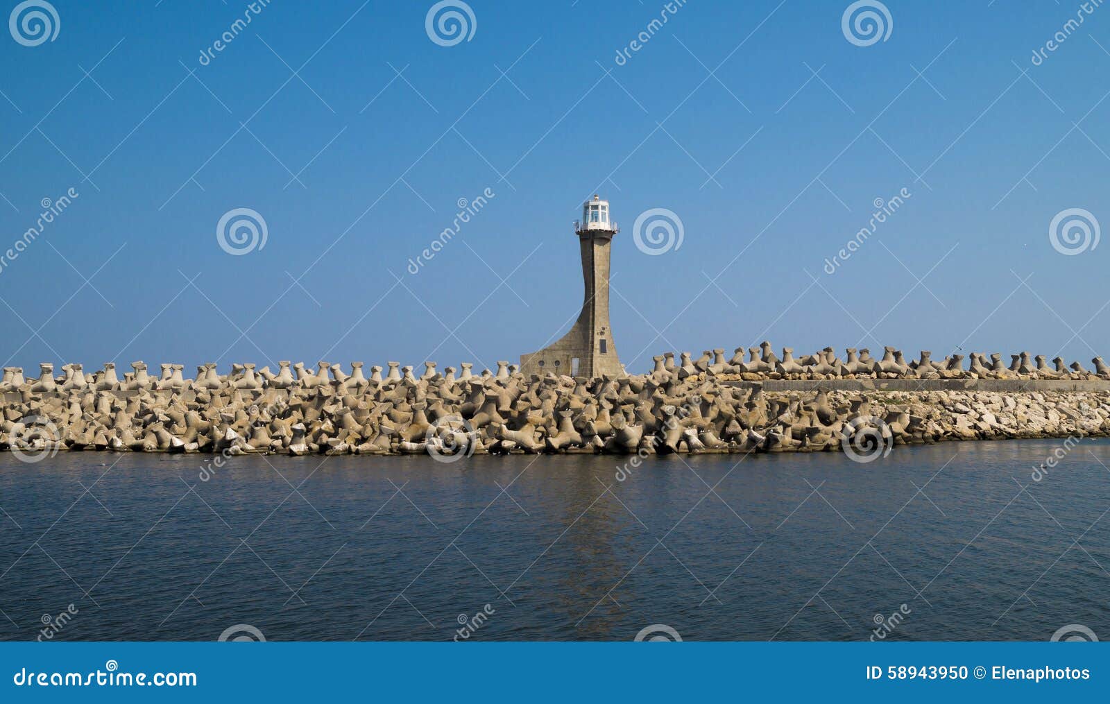 Lighthouse and Breakwaters in Port Constanta Stock Photo - Image of ...