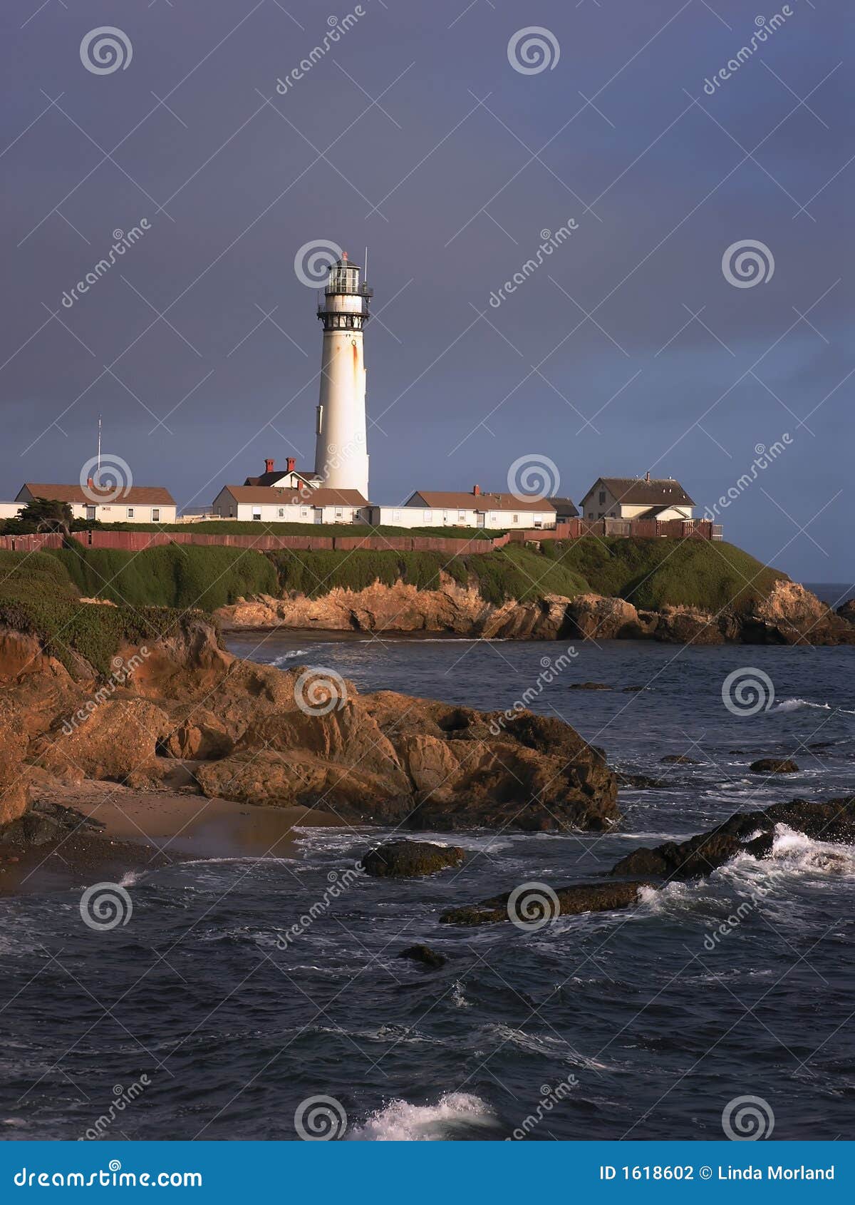 Lighthouse with Buildings stock photo. Image of light - 1618602