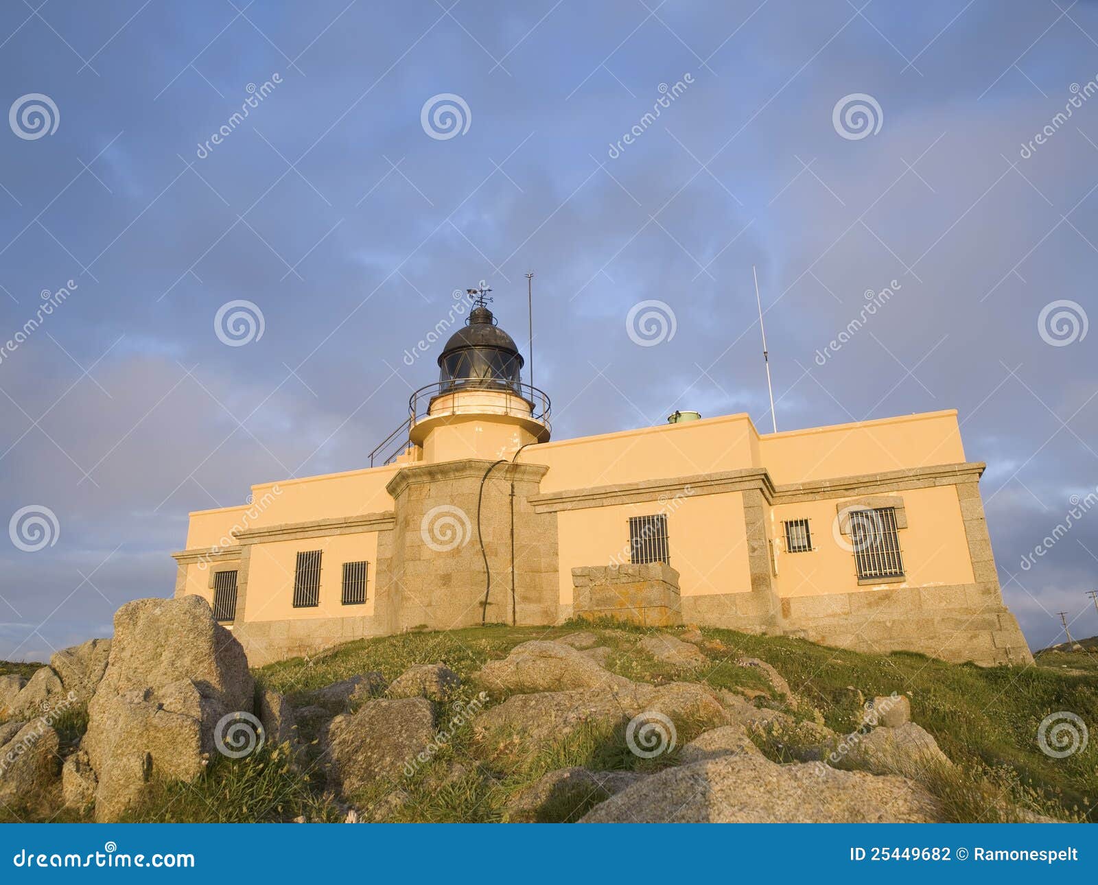 Lighthouse Built on a Building at Sunset Stock Photo - Image of ...