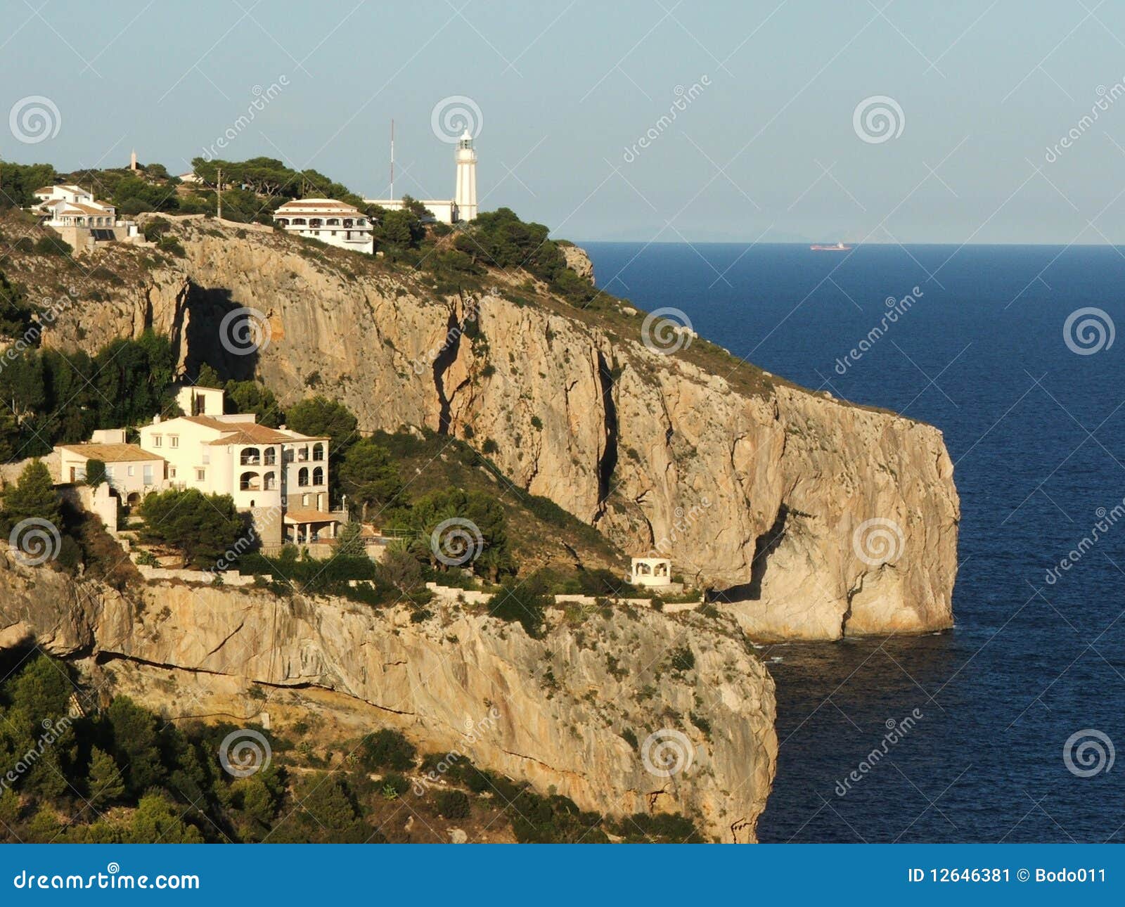 Lighthouse on the clif stock image. Image of water, costa - 12646381